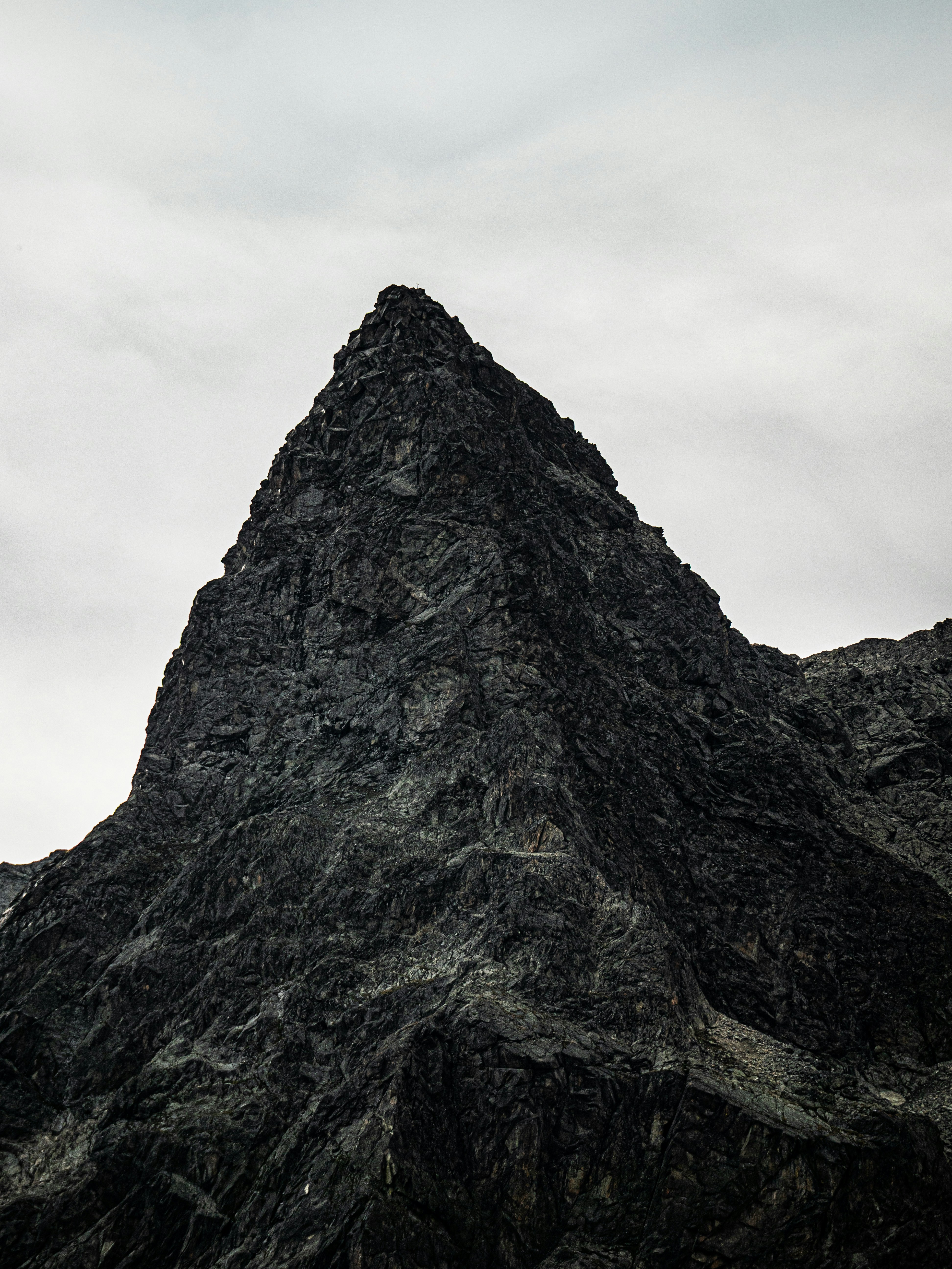 A Monolithic Peak Piercing a Misty Sky