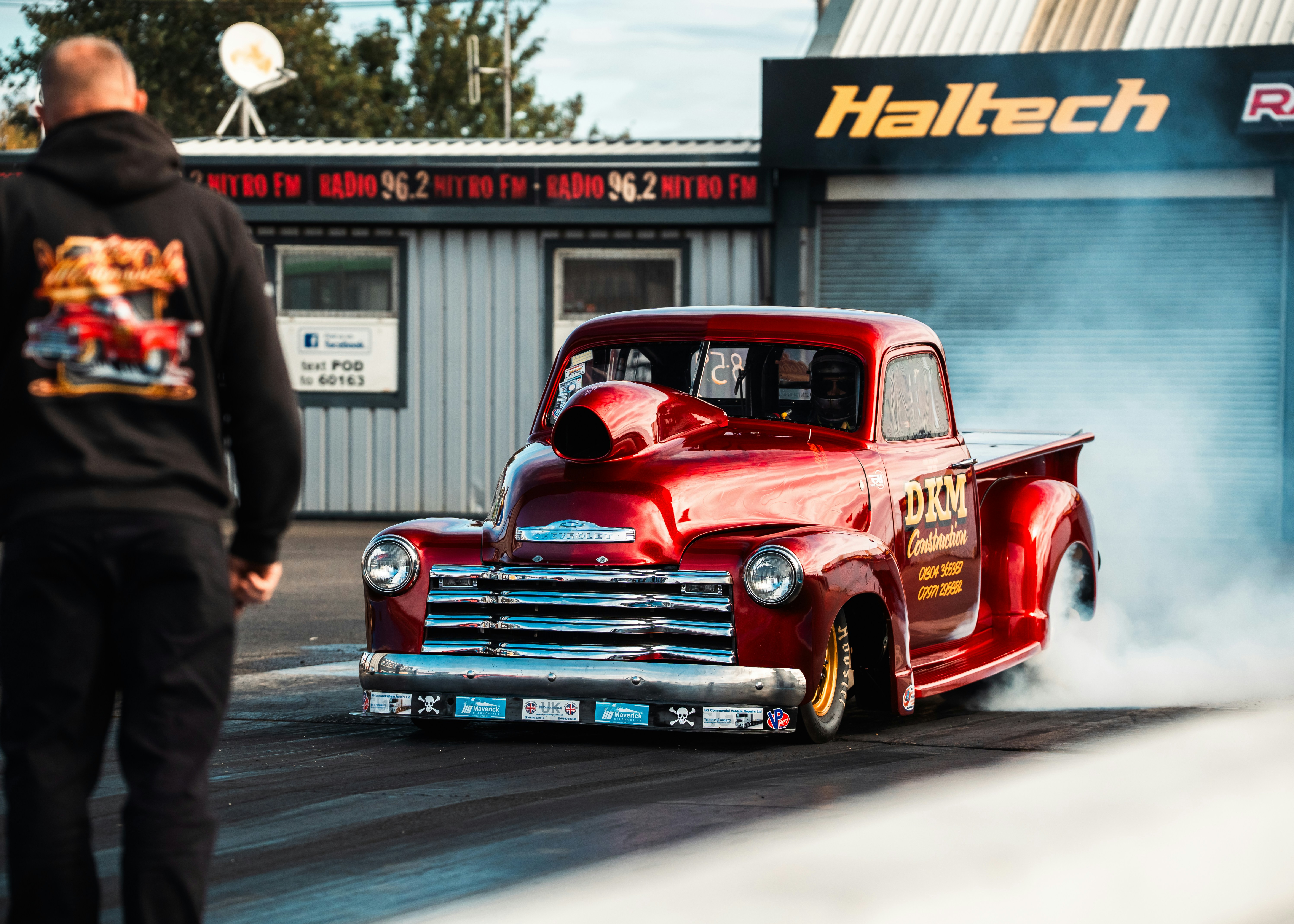 Red Fury at the Line: A Nitro-Hauling Pickup in the Smoke
