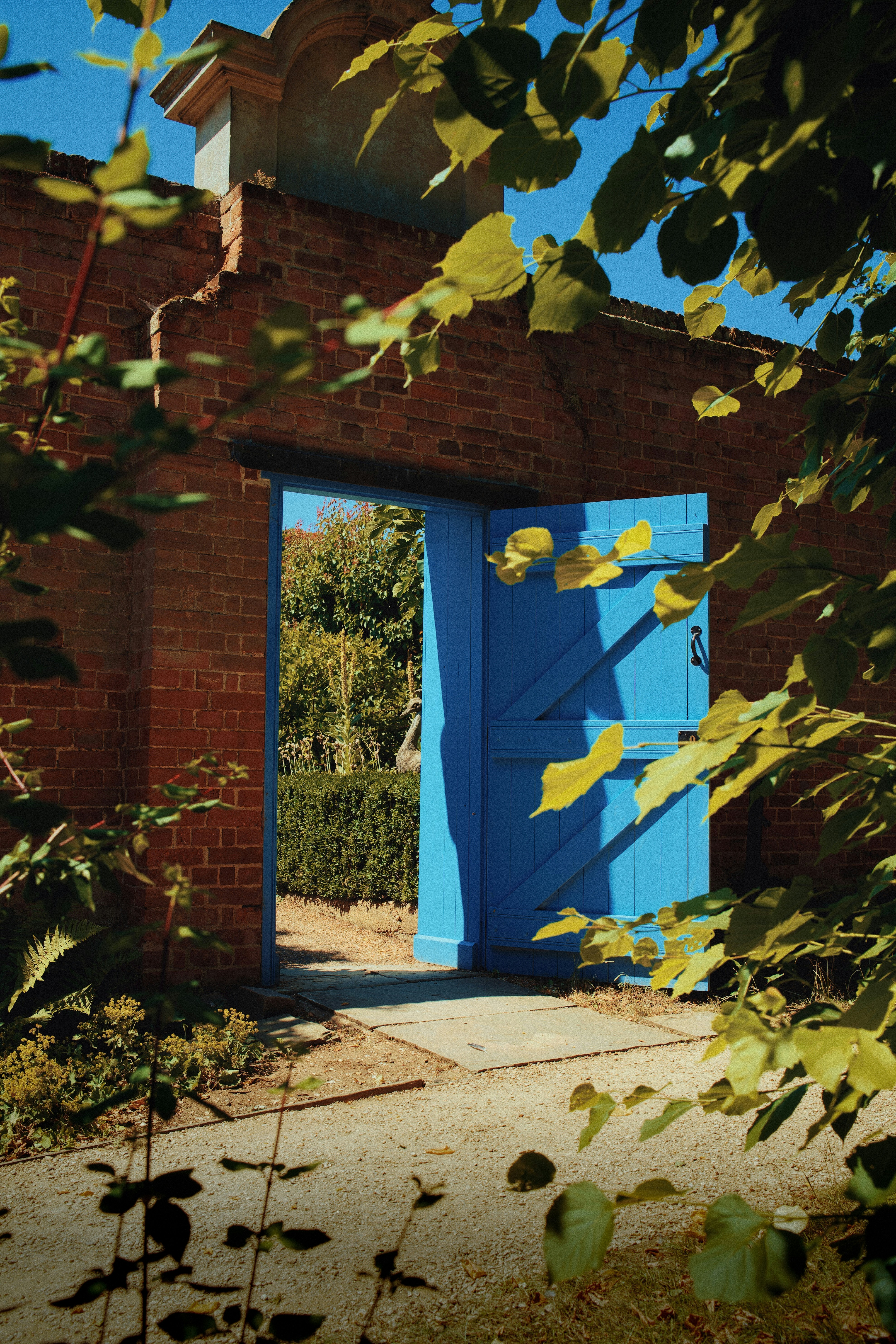 Azure Doorway: A Quiet Portal Through Brick and Light