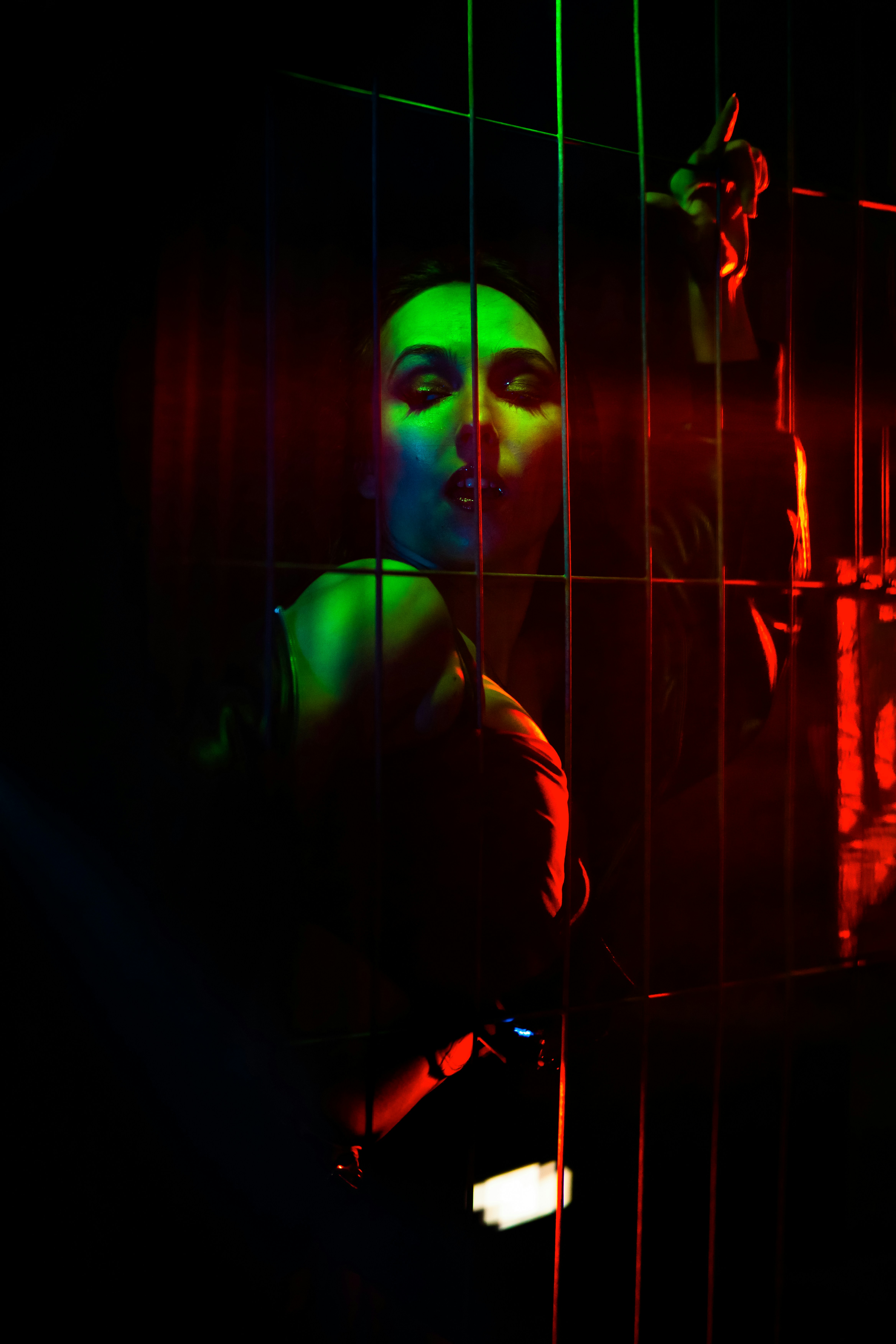 Neon Veil: A Face Behind Green Bars
