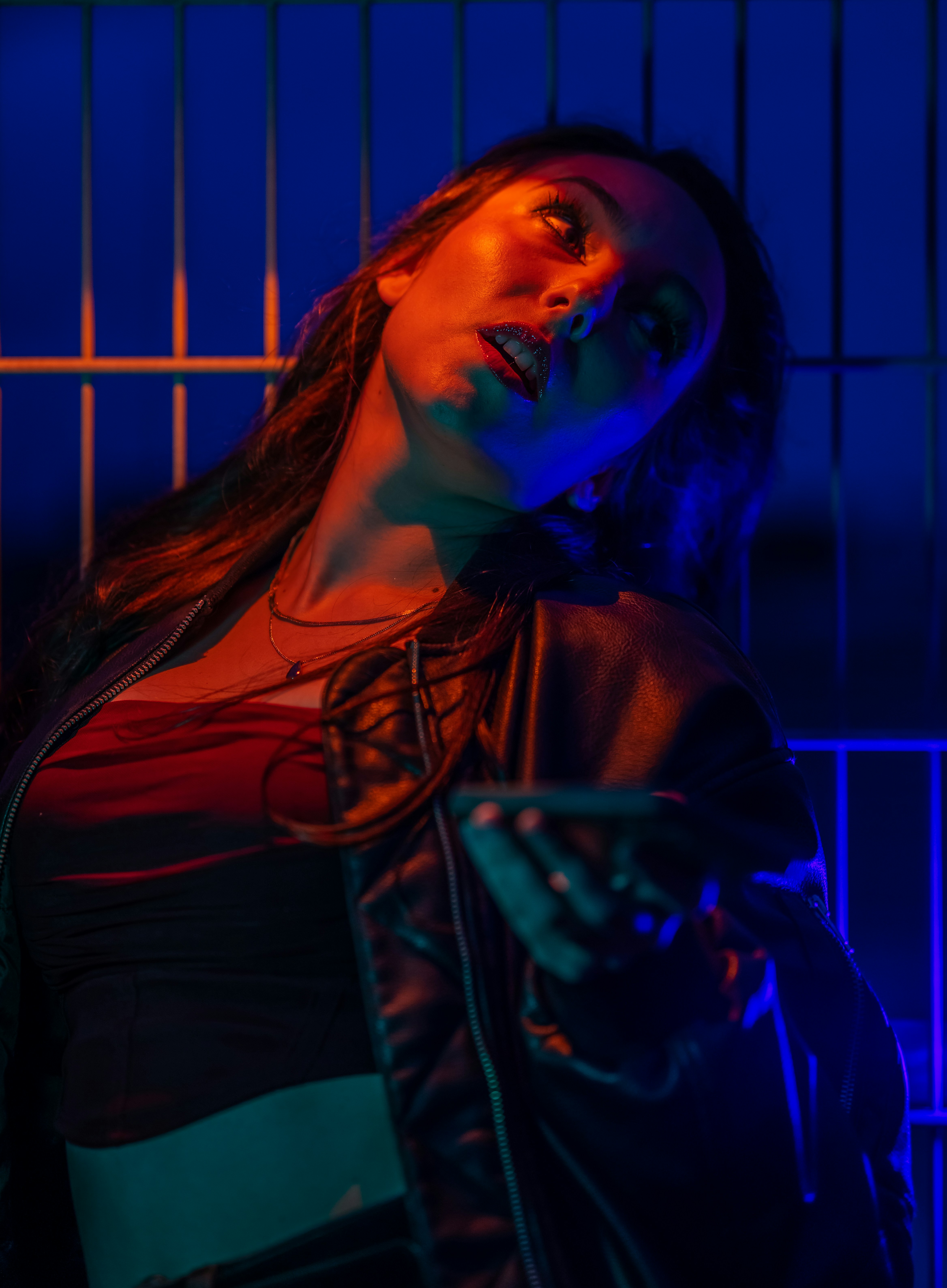 Neon Burn: Portrait of a Rebel in Blue-Red Haze