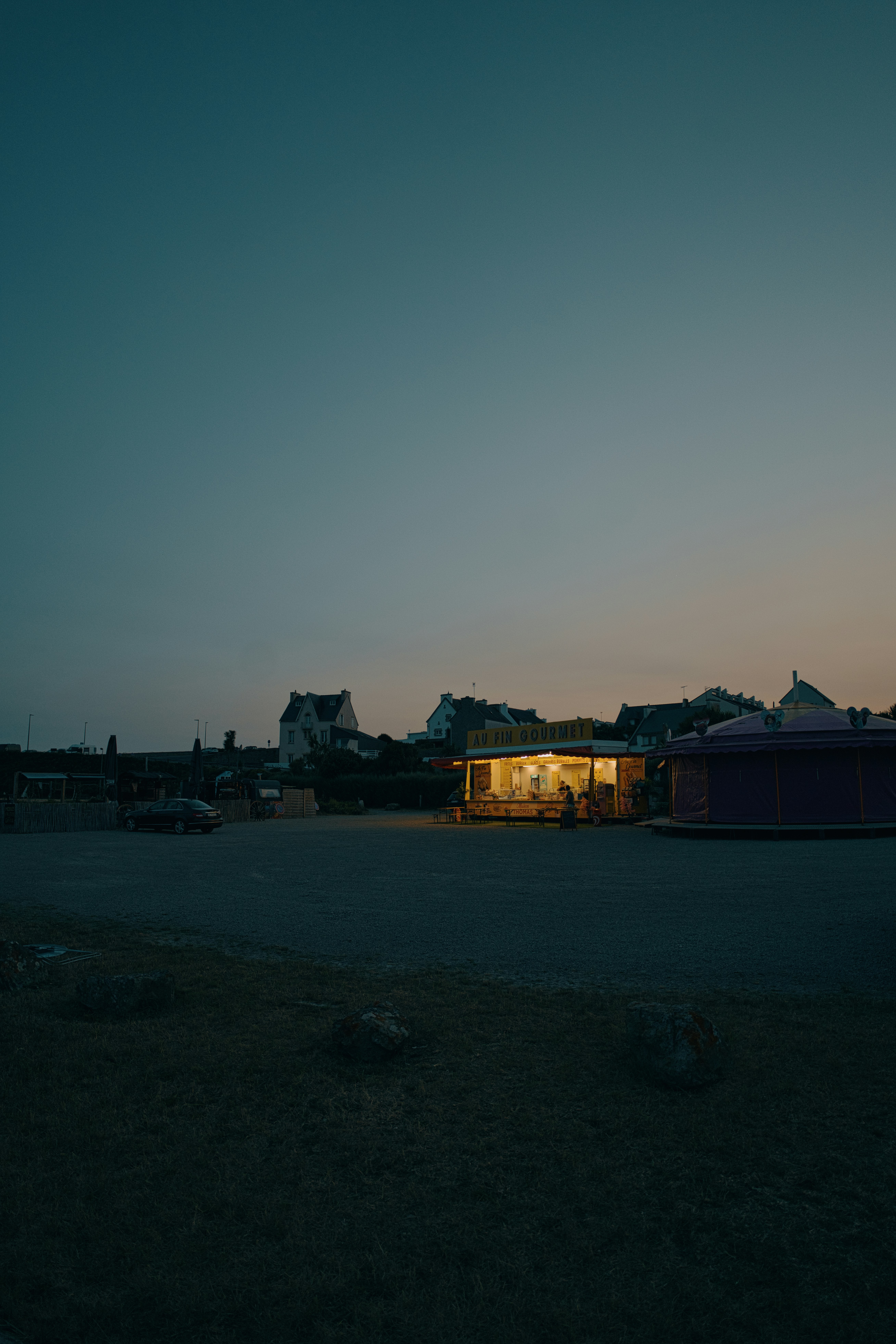 Golden Snack Stand at Dusk on a Quiet Beachfront