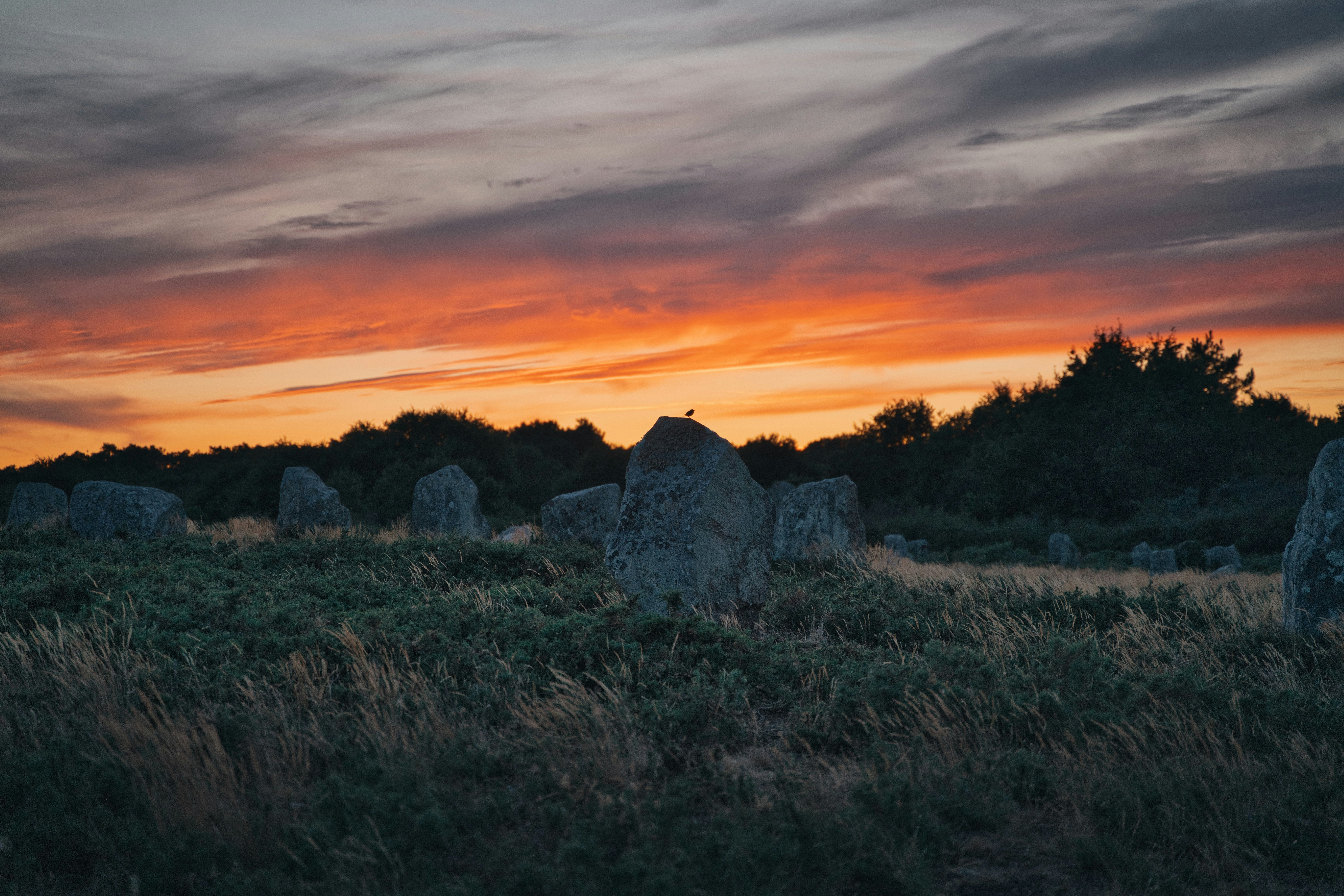Stone Circle at Sunset: A Quiet Moor Under a Fiery Sky