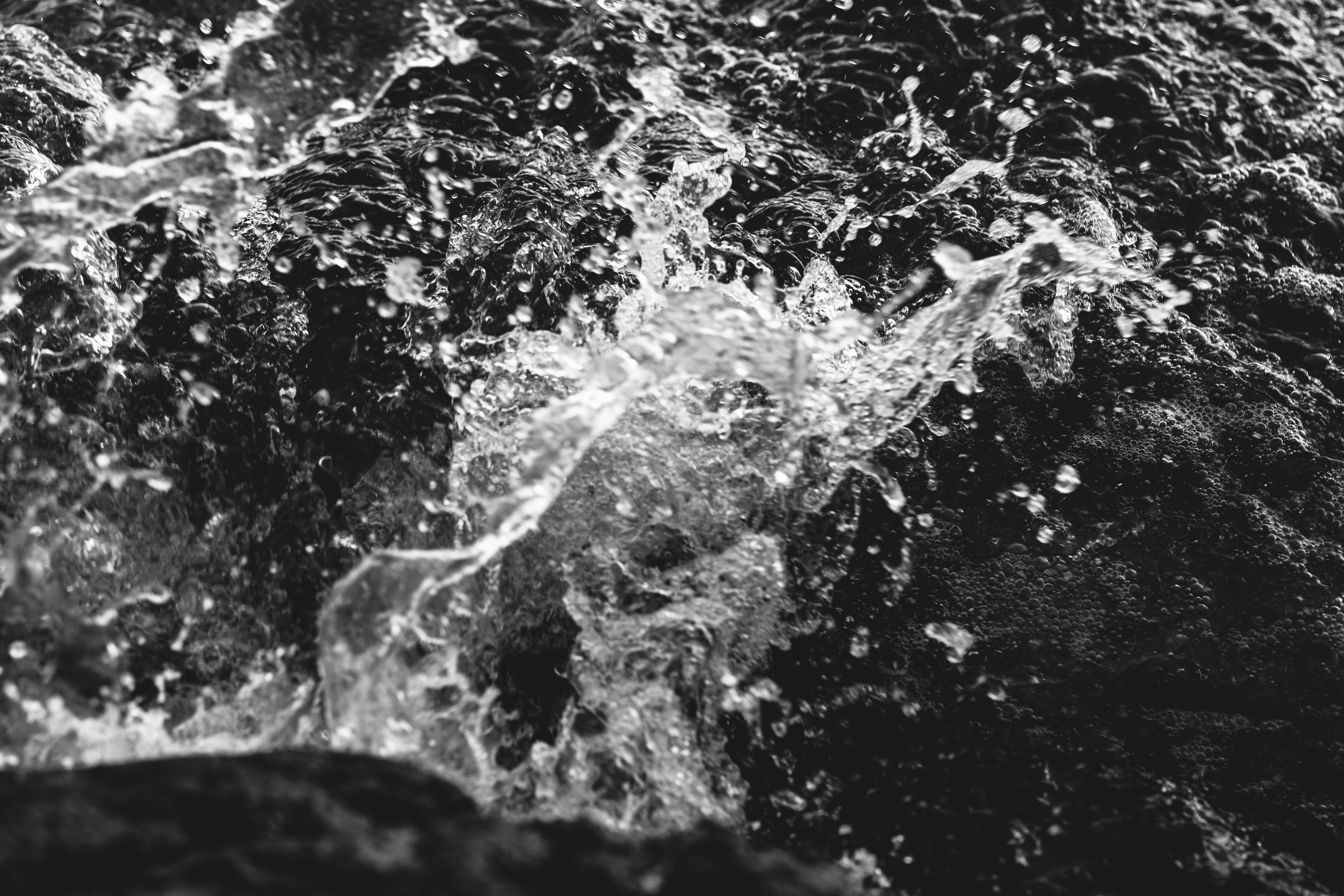 Rushing White Space: A Close-Cropped Splash in Monochrome