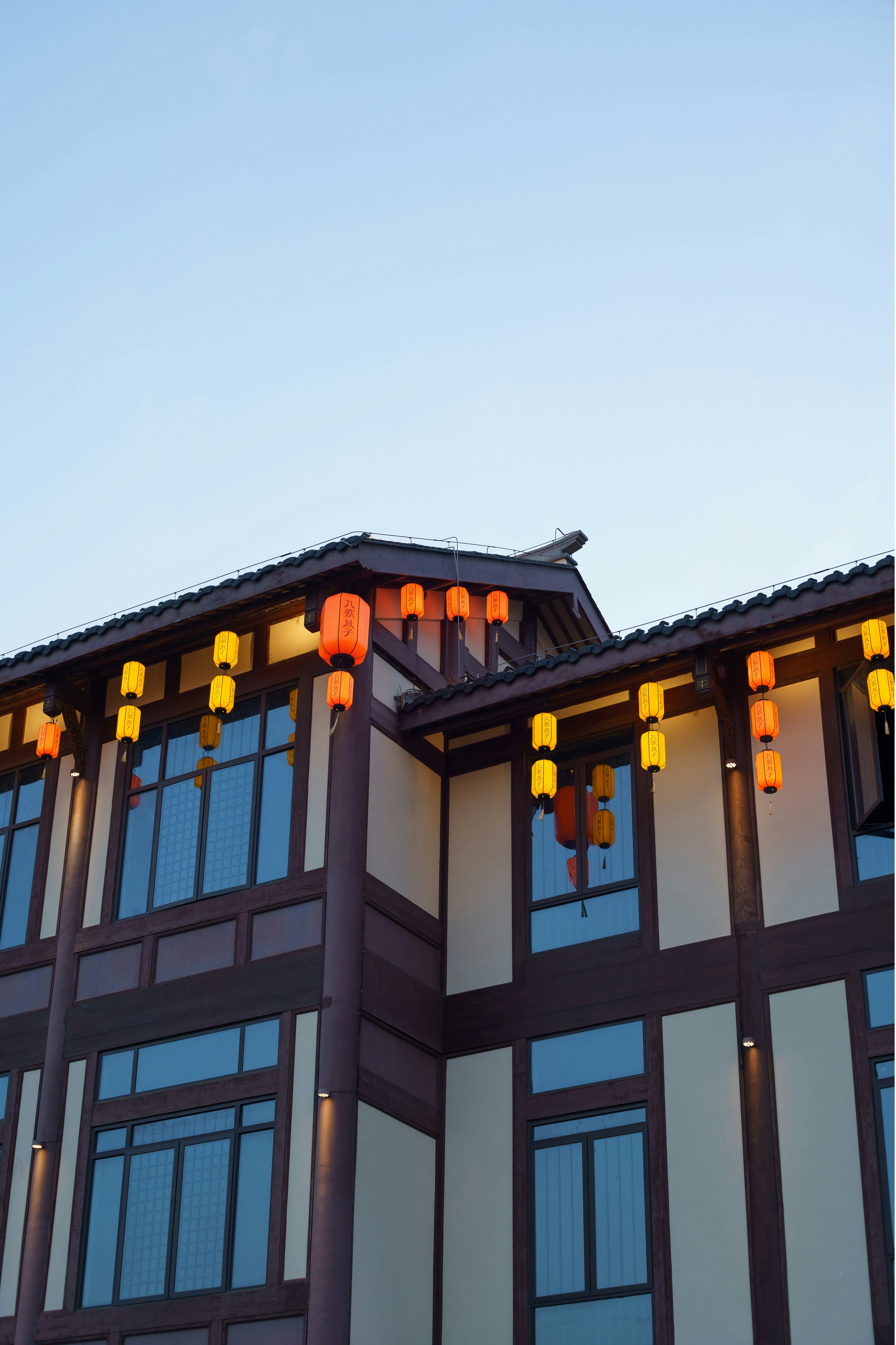 Lanterns Crest the Eaves of Timbered Charm