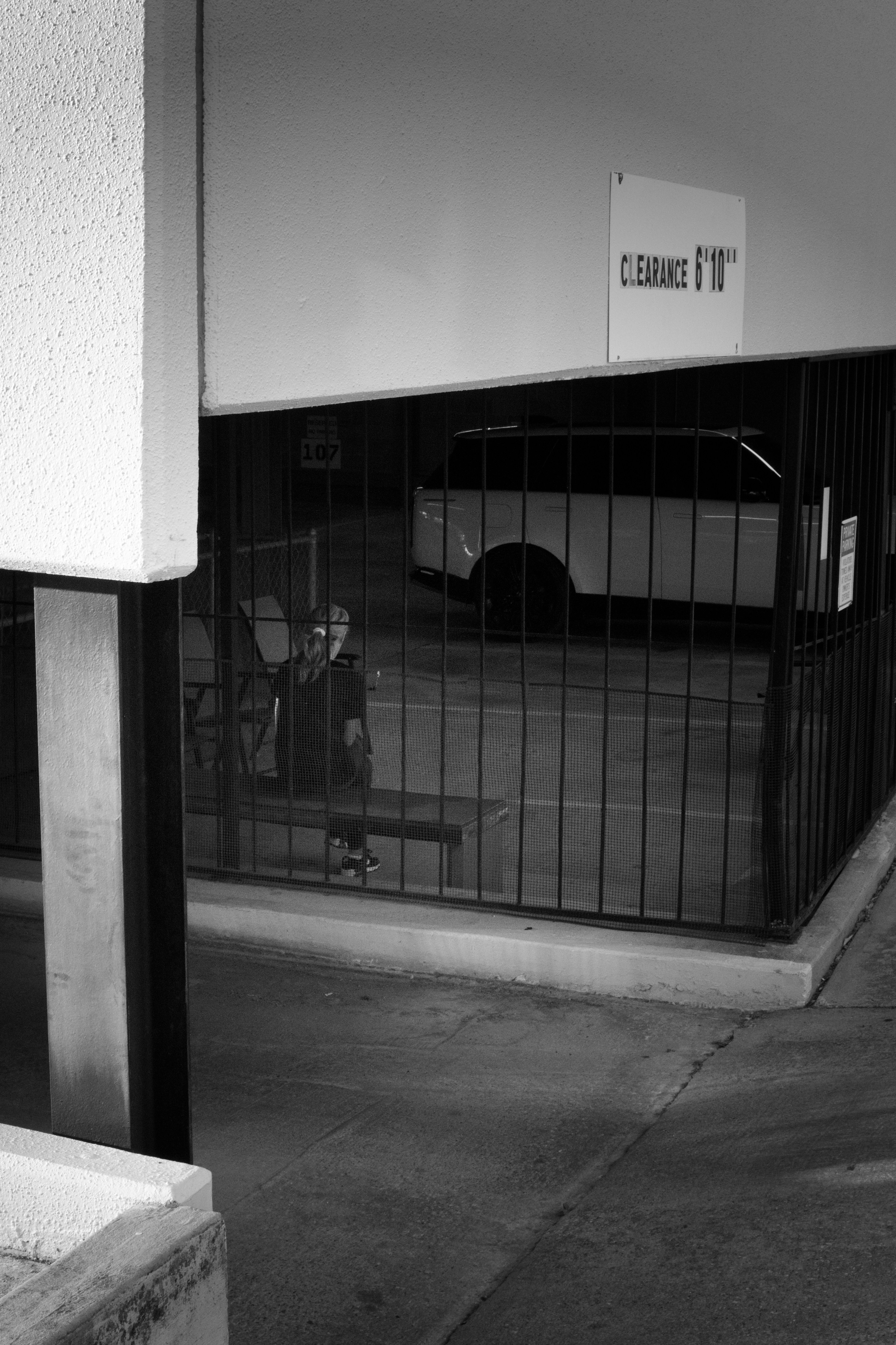 Shadowed Parking Structure: A Quiet Moment in the Gate