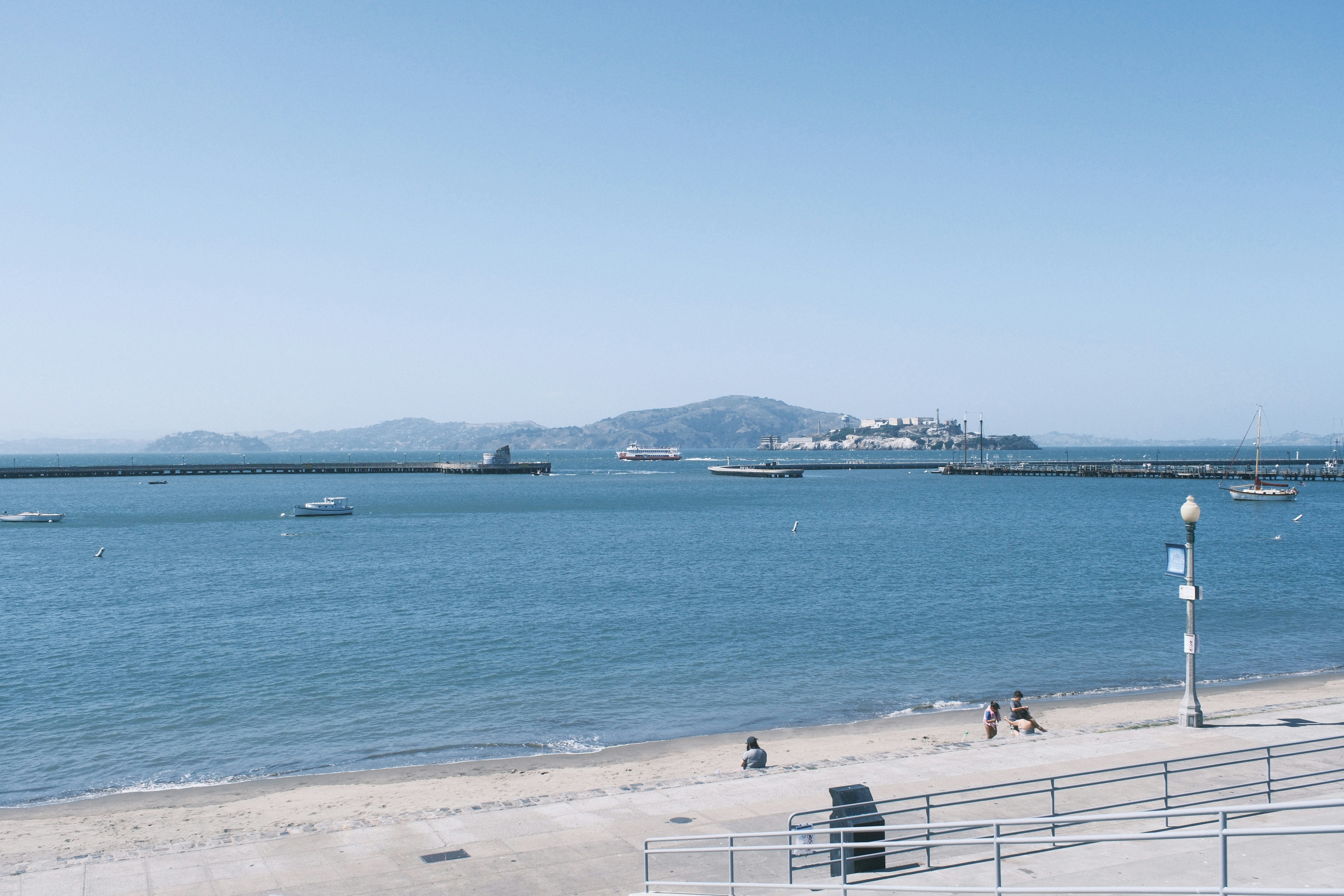 Harbor Calm: Distant Hills Behind a Quiet Seaside