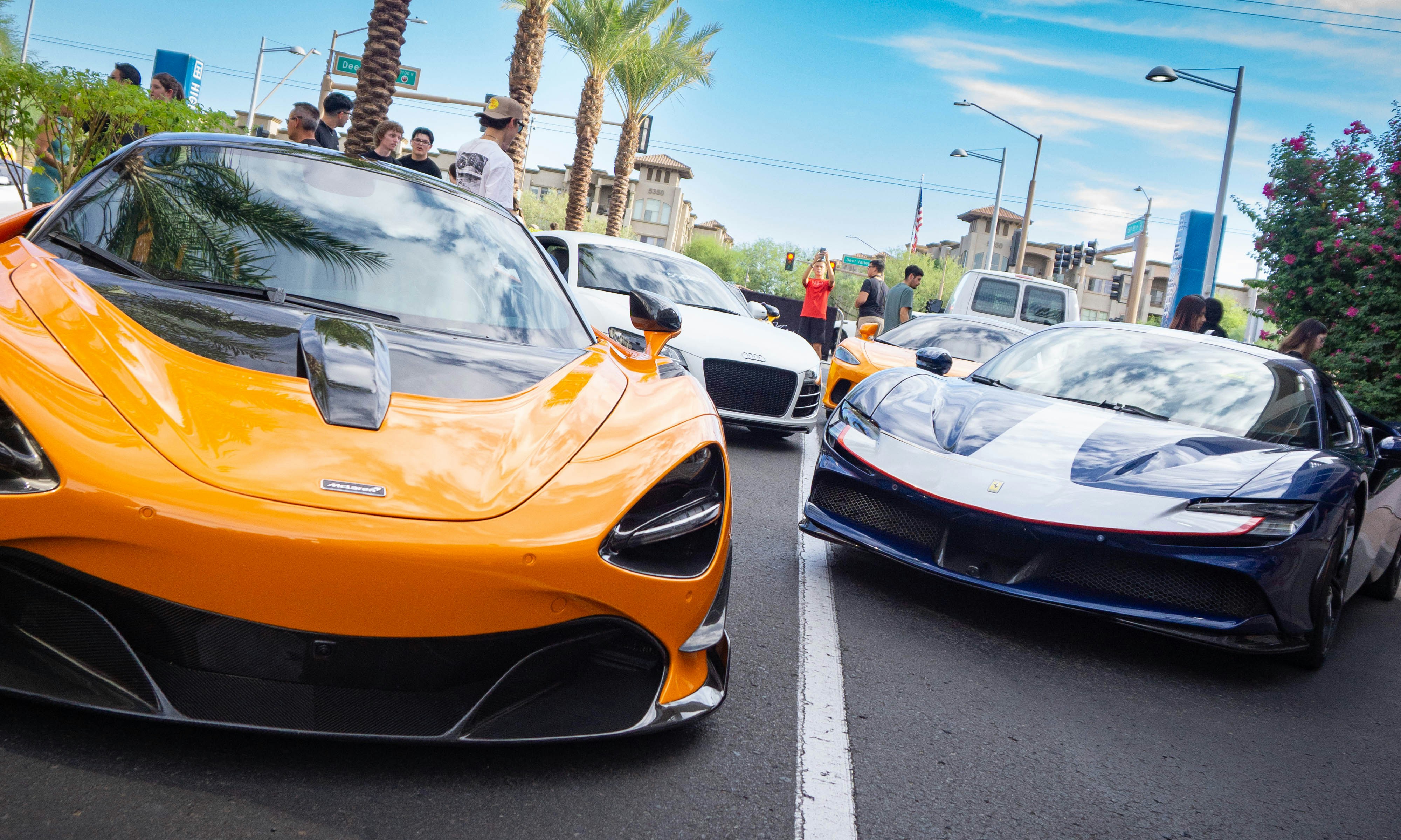 Fiery Orange Exotic in a Street-Meet Parade