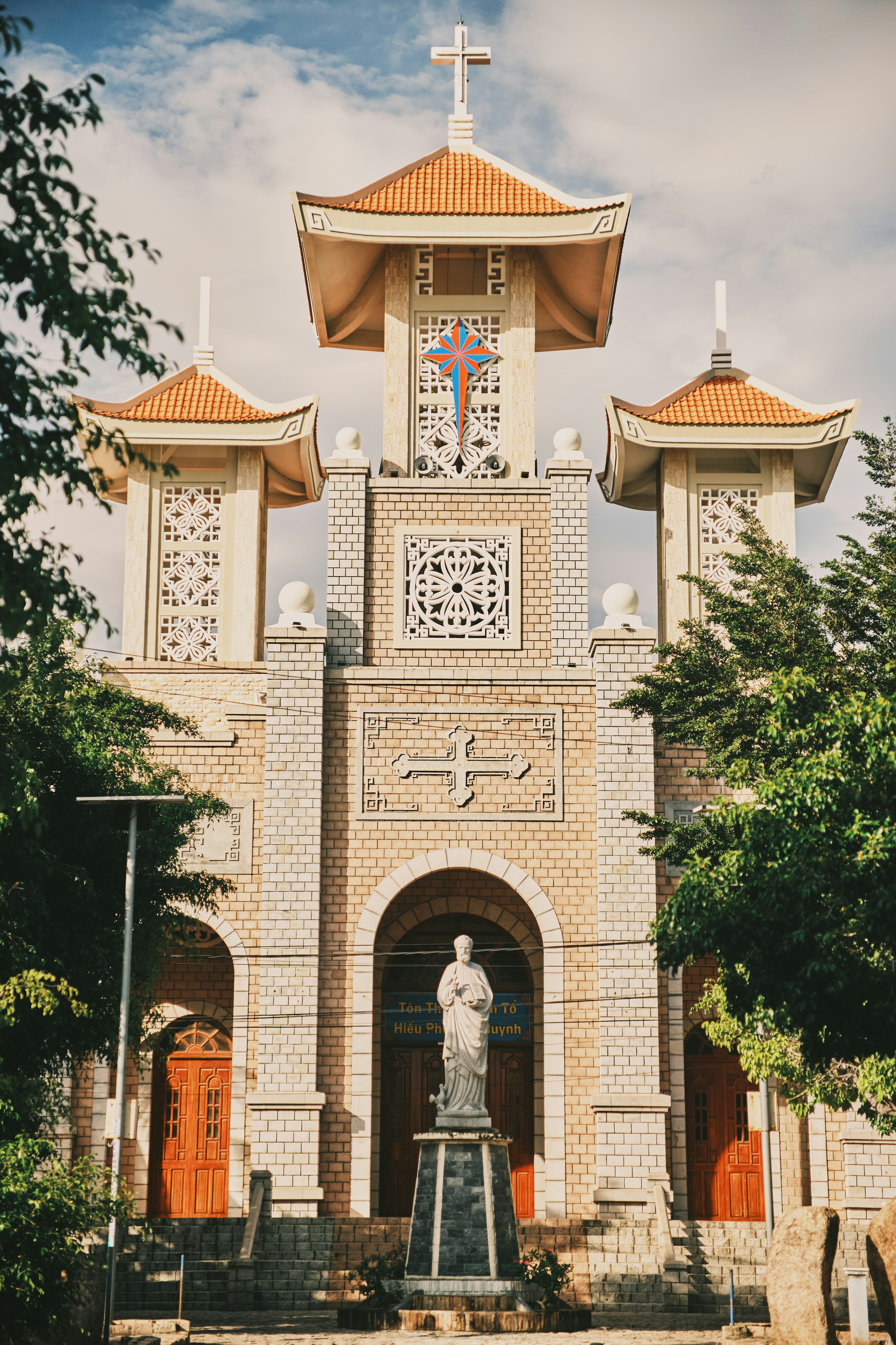 Sacred Facade: A Cathedral Crowned by Towers and a Statue Gate