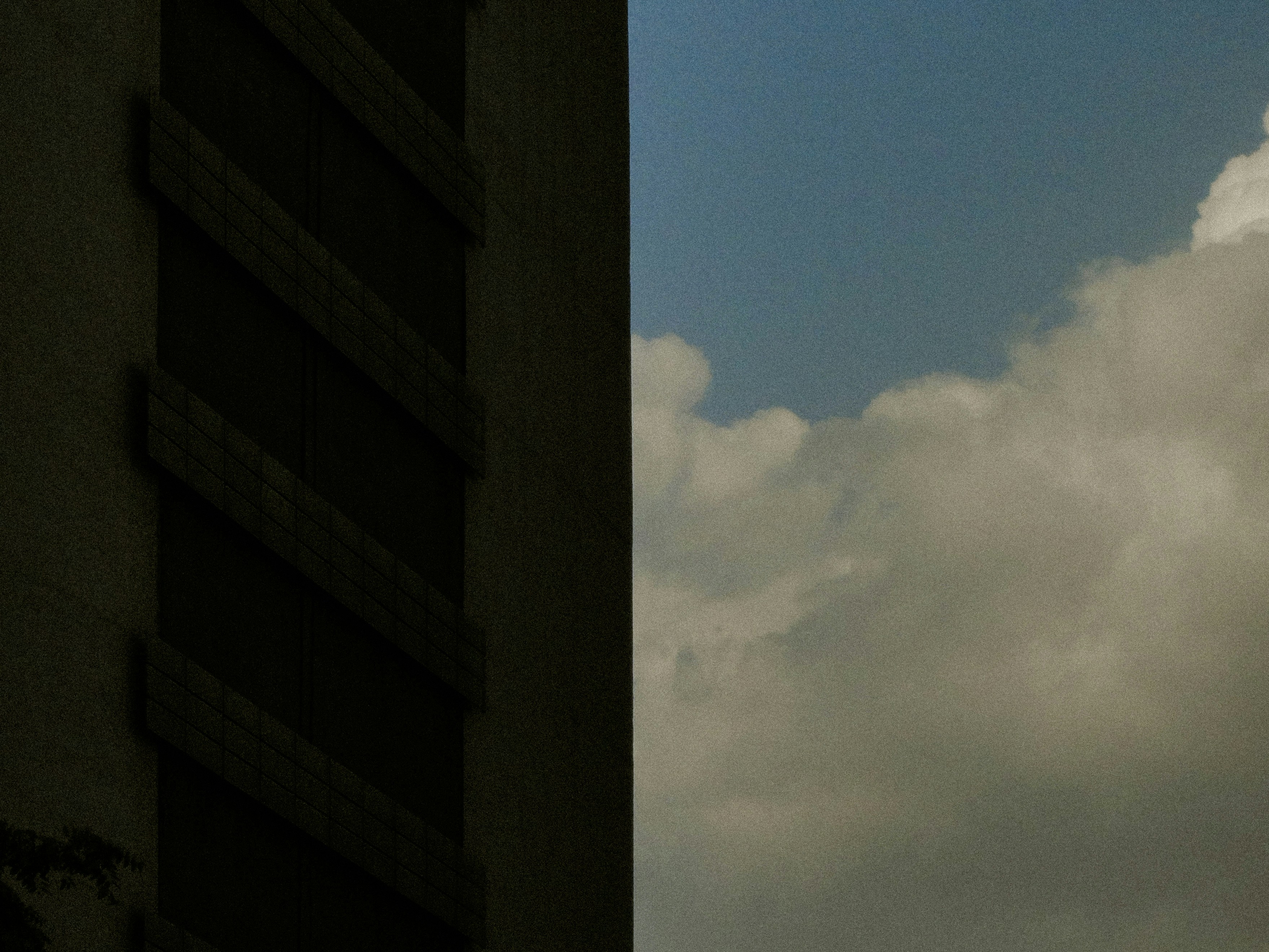 Shadowed Facade and Sky: A Quiet City Slice