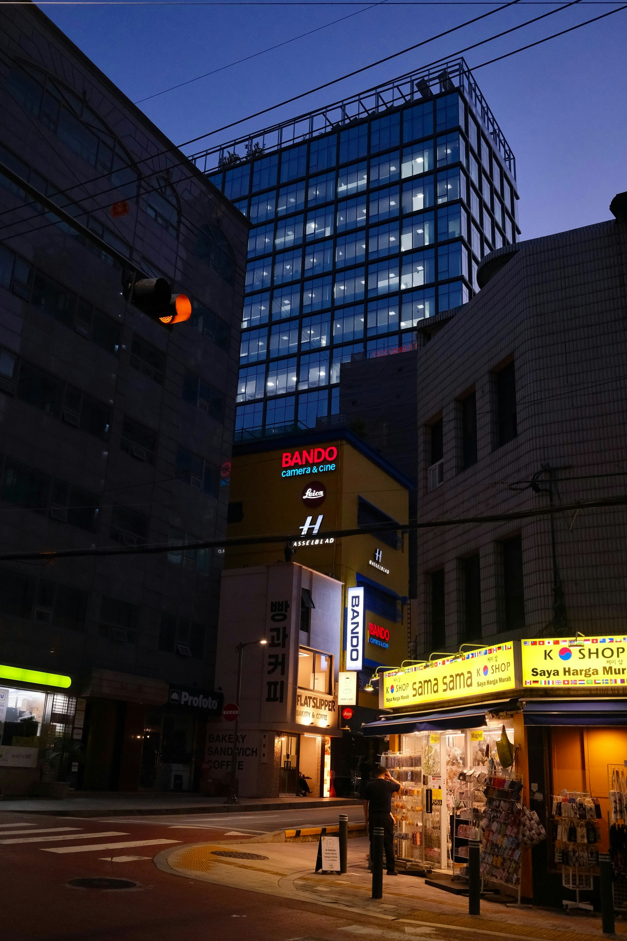 Neon Crossroads: Night Market Beneath a Glassy Tower