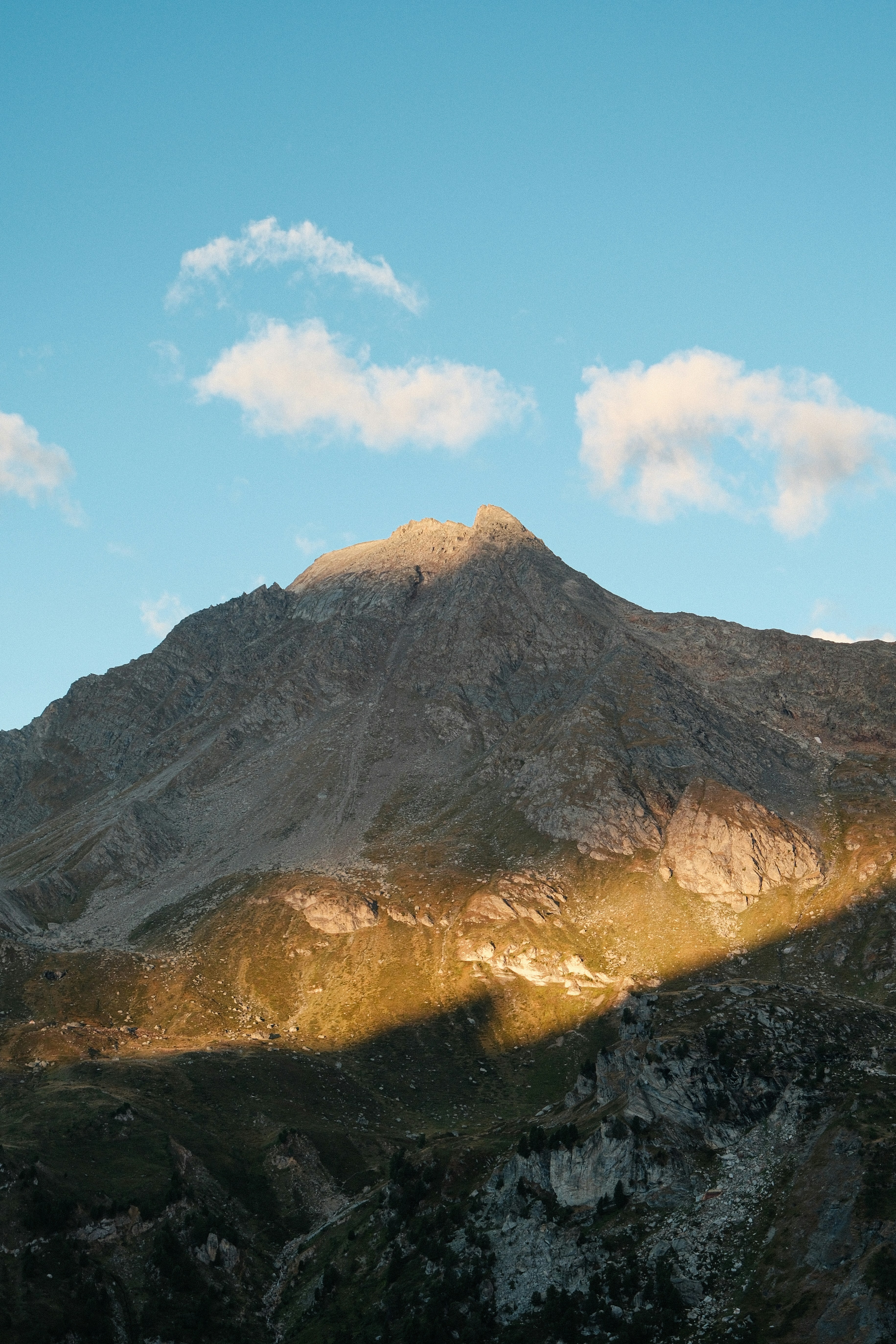 Sunlit Peak: The Golden Crest Above The Valleys