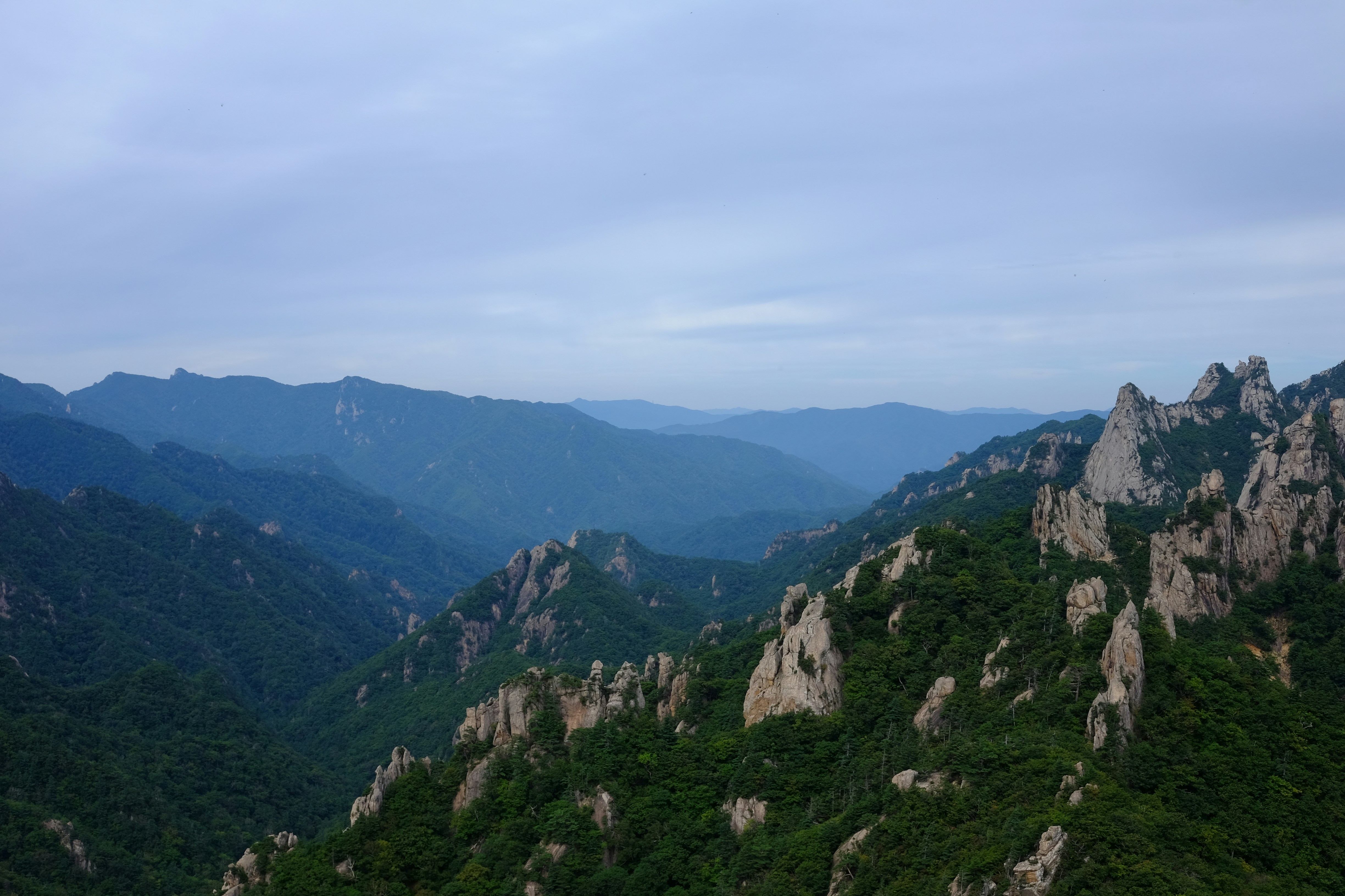Rugged Peaks Unfold Across an Ember Sky