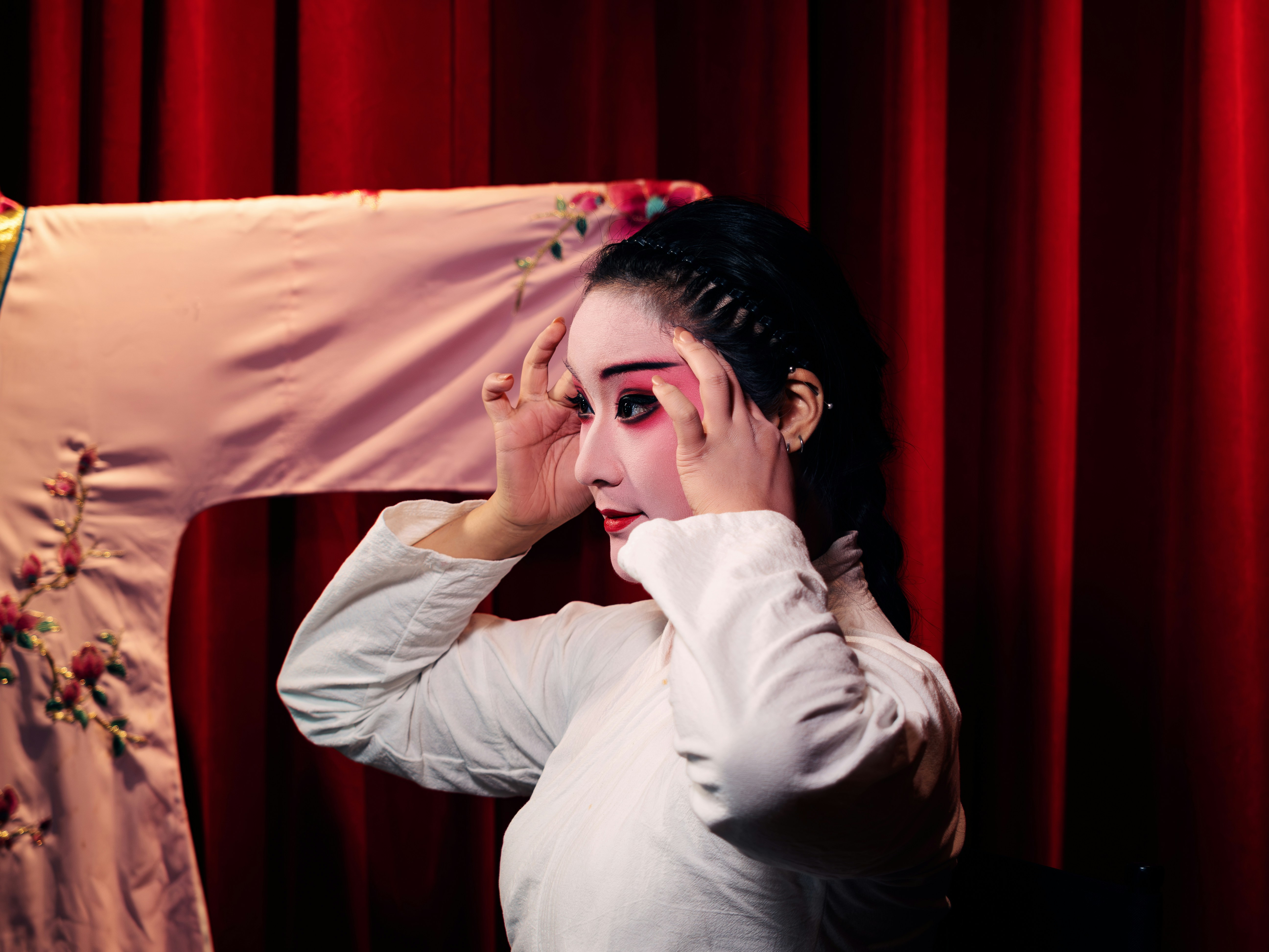 Red Velvet Veil: A Portrait of Resolve under Crimson Curtains