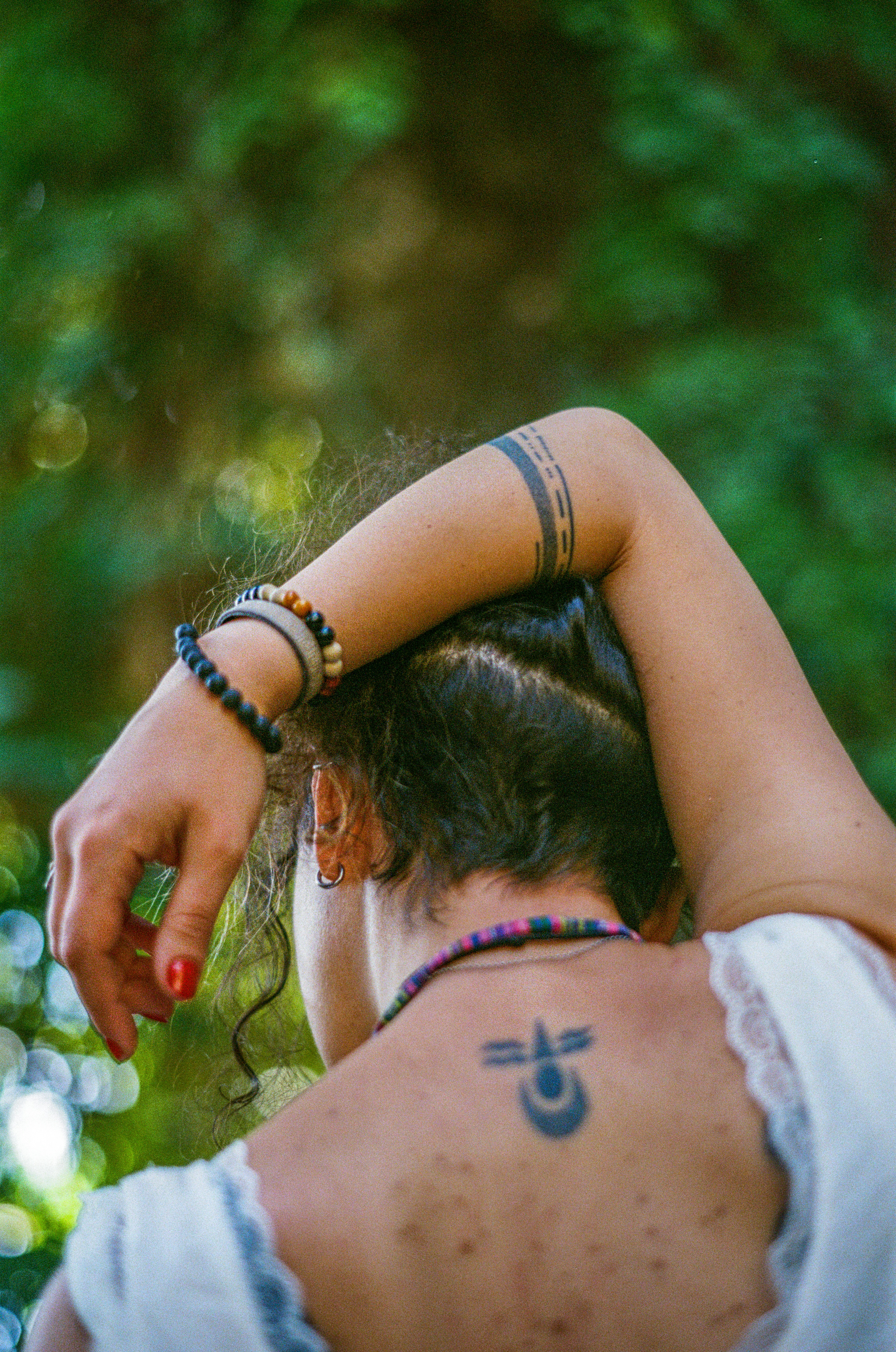 Back-Contour Portrait: Tattoos, Hair, and Outdoors