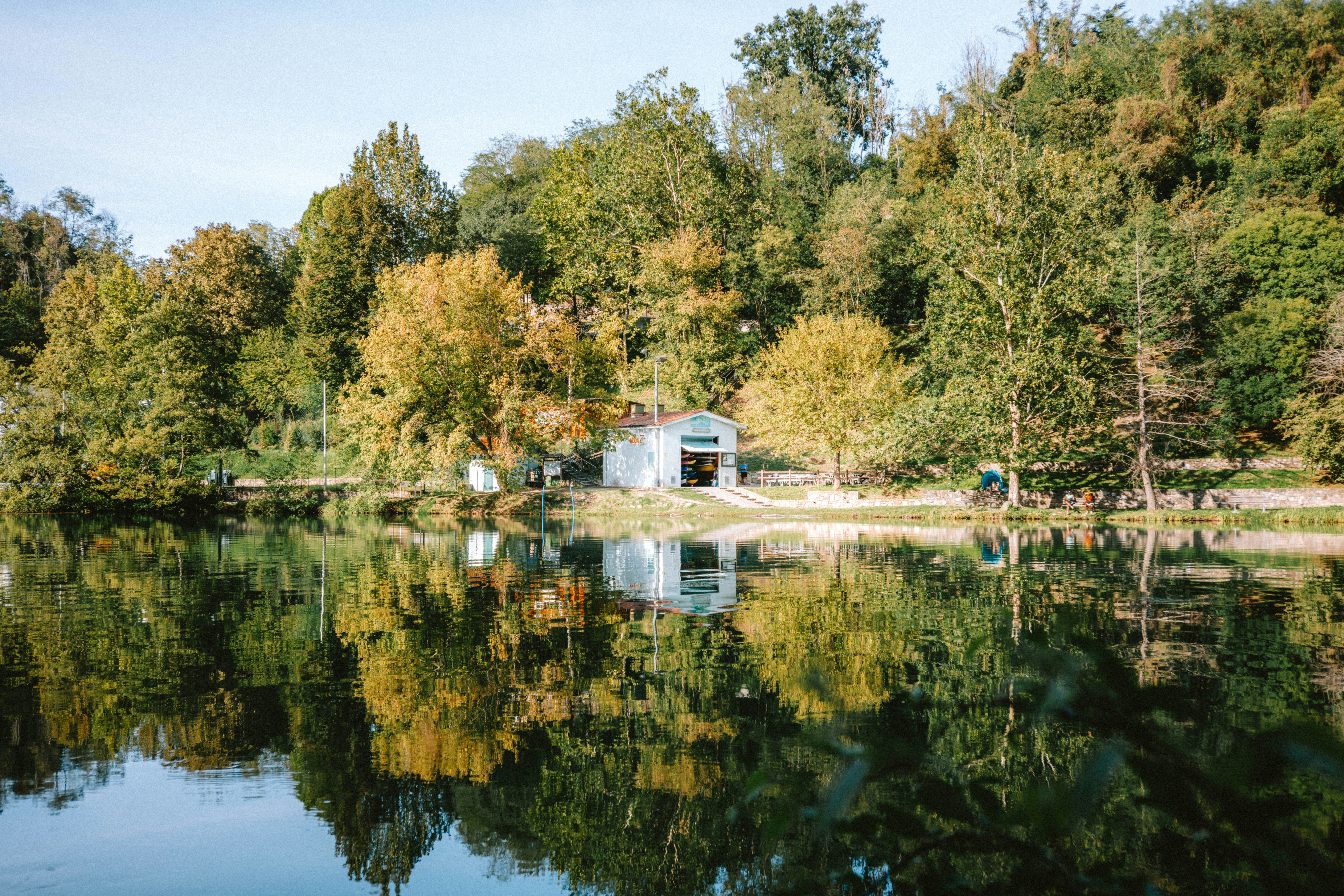Autumn Mirror: Lakeside House Framed by Quiet Trees