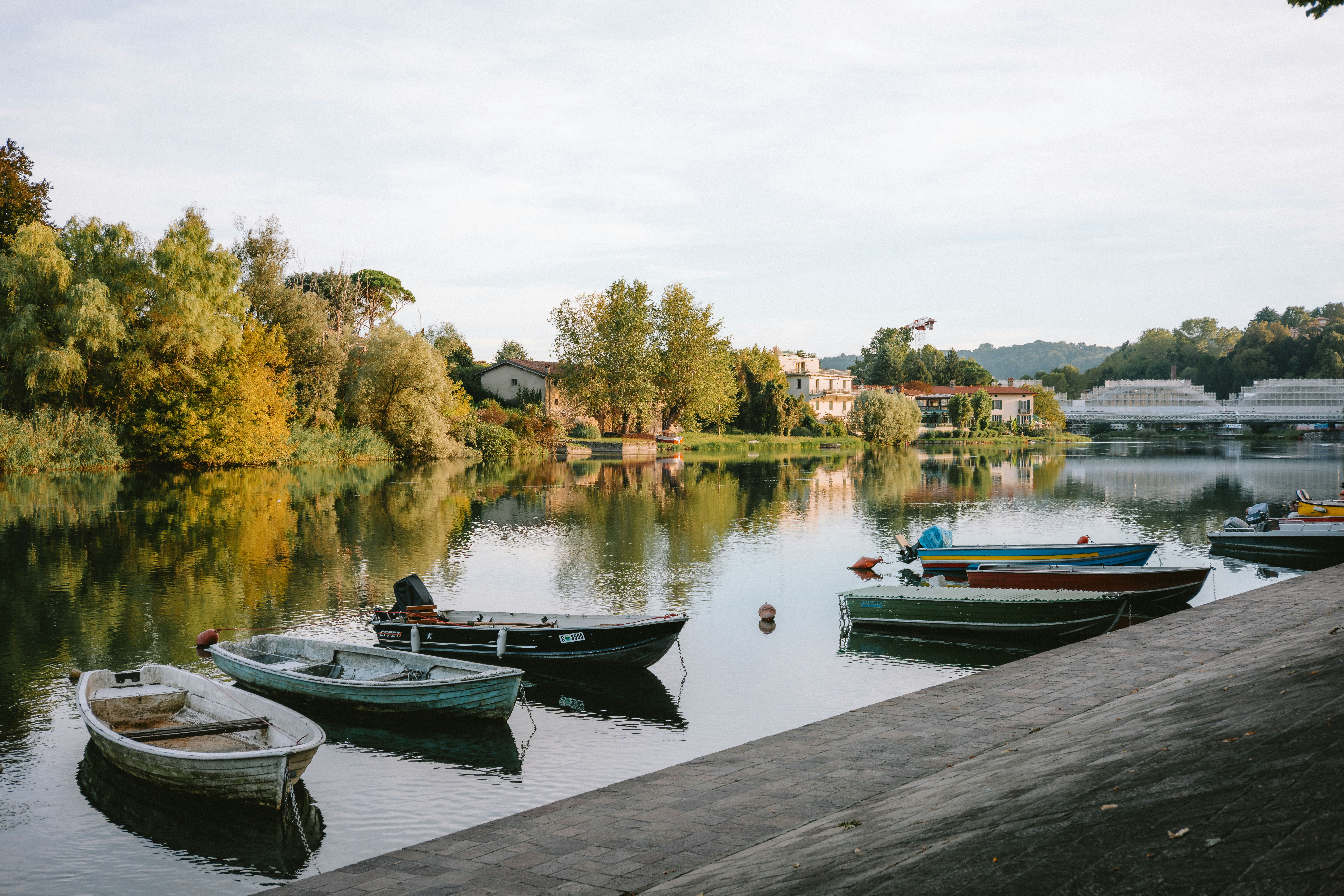 Quiet Marina Reverie: Boats Docked Along a Serene Riverside