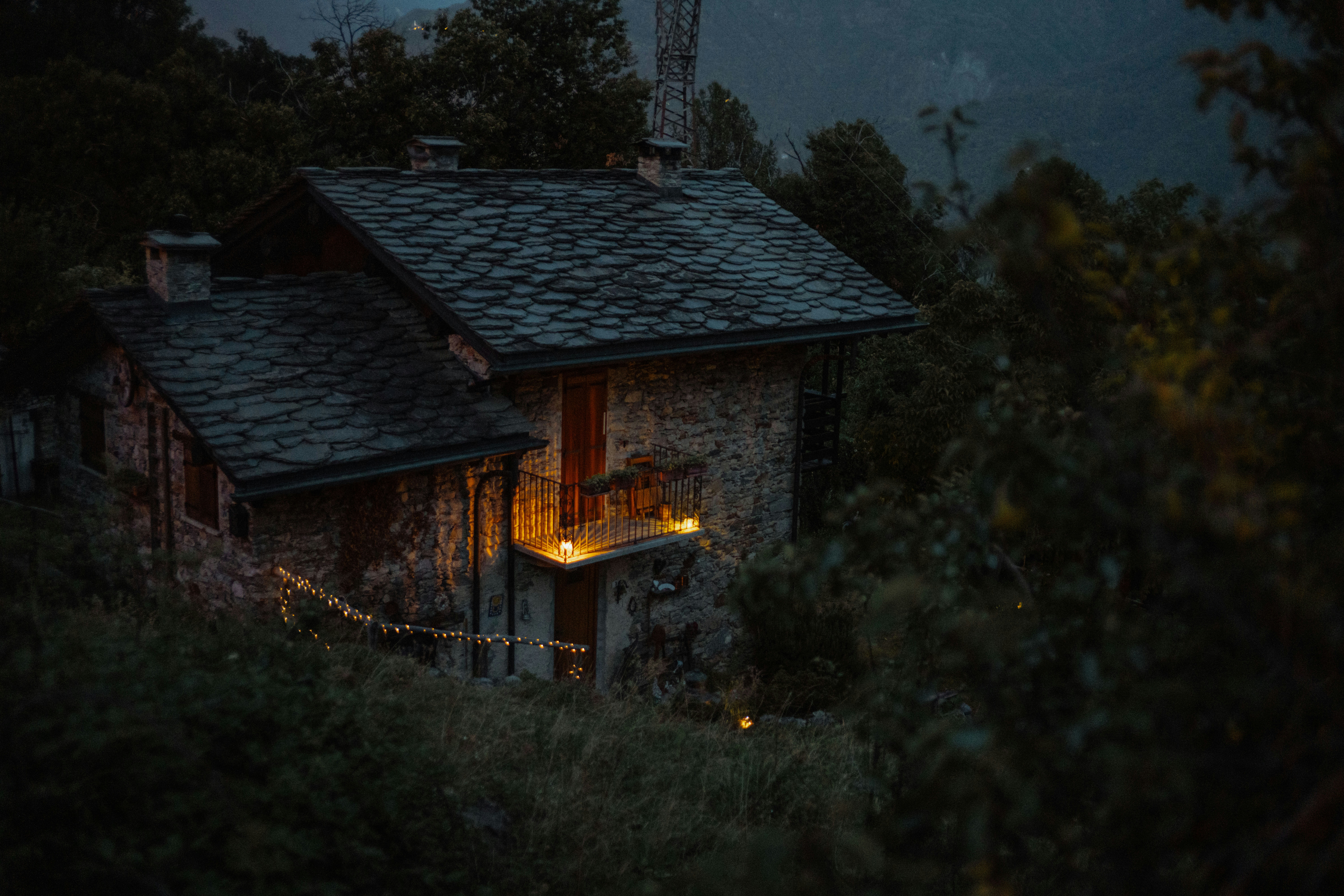 Cozy Mountain Cabin Glowing through Dusk