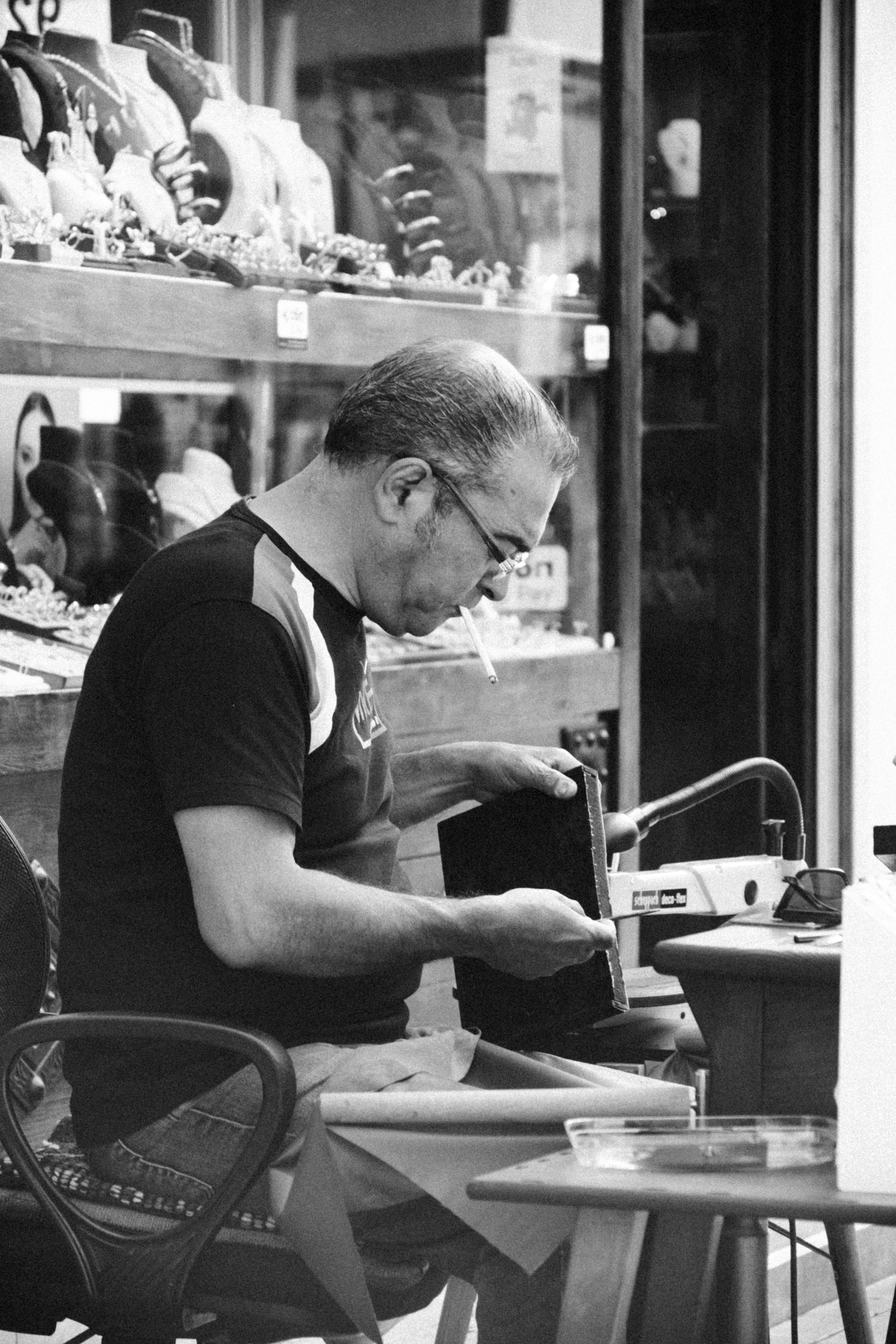 Smoking Quiet Focus: Portrait of a Craftsman in a Shop Window