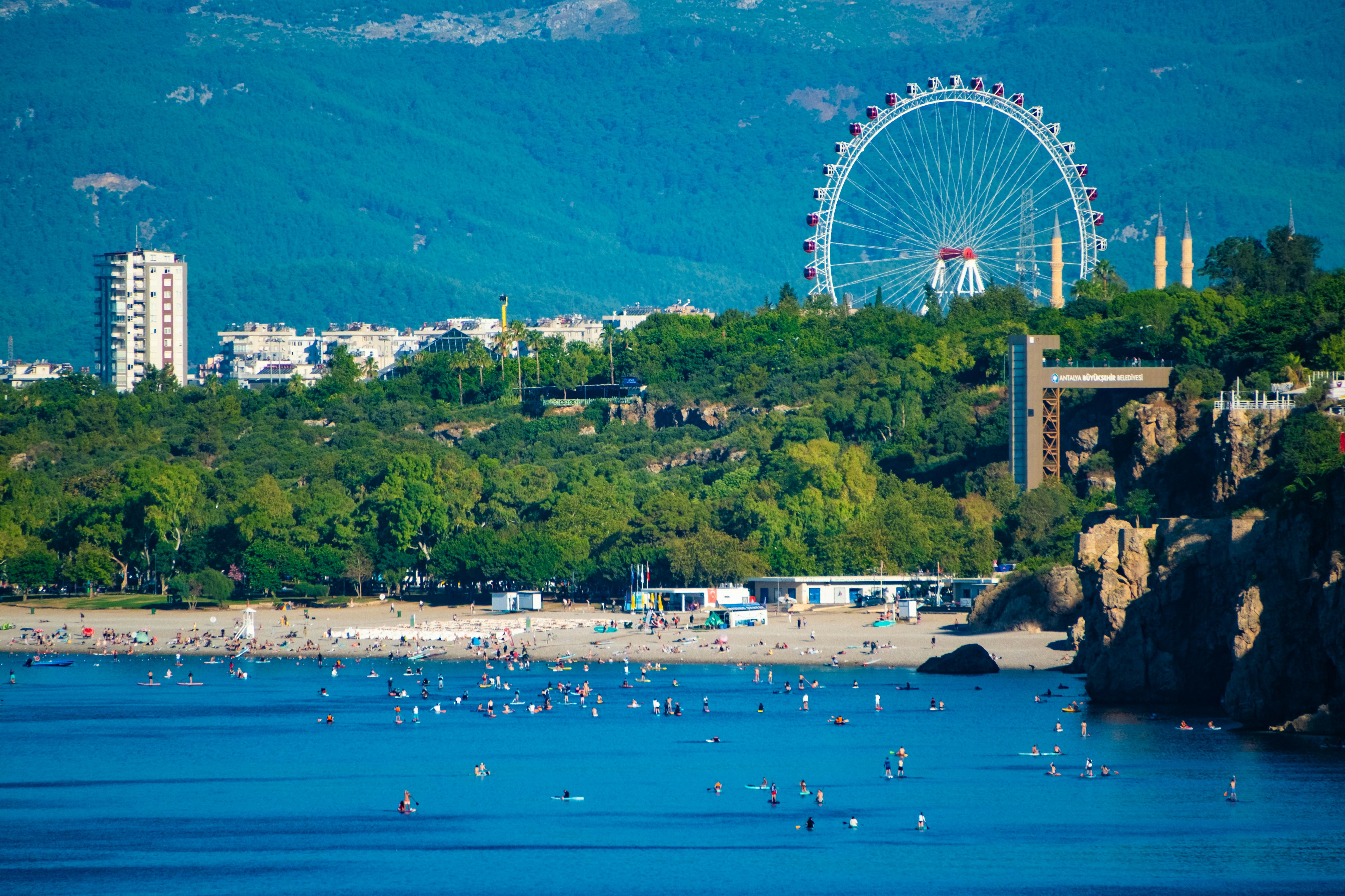 Ferris Wheel Overlooking a Sunlit Beach City