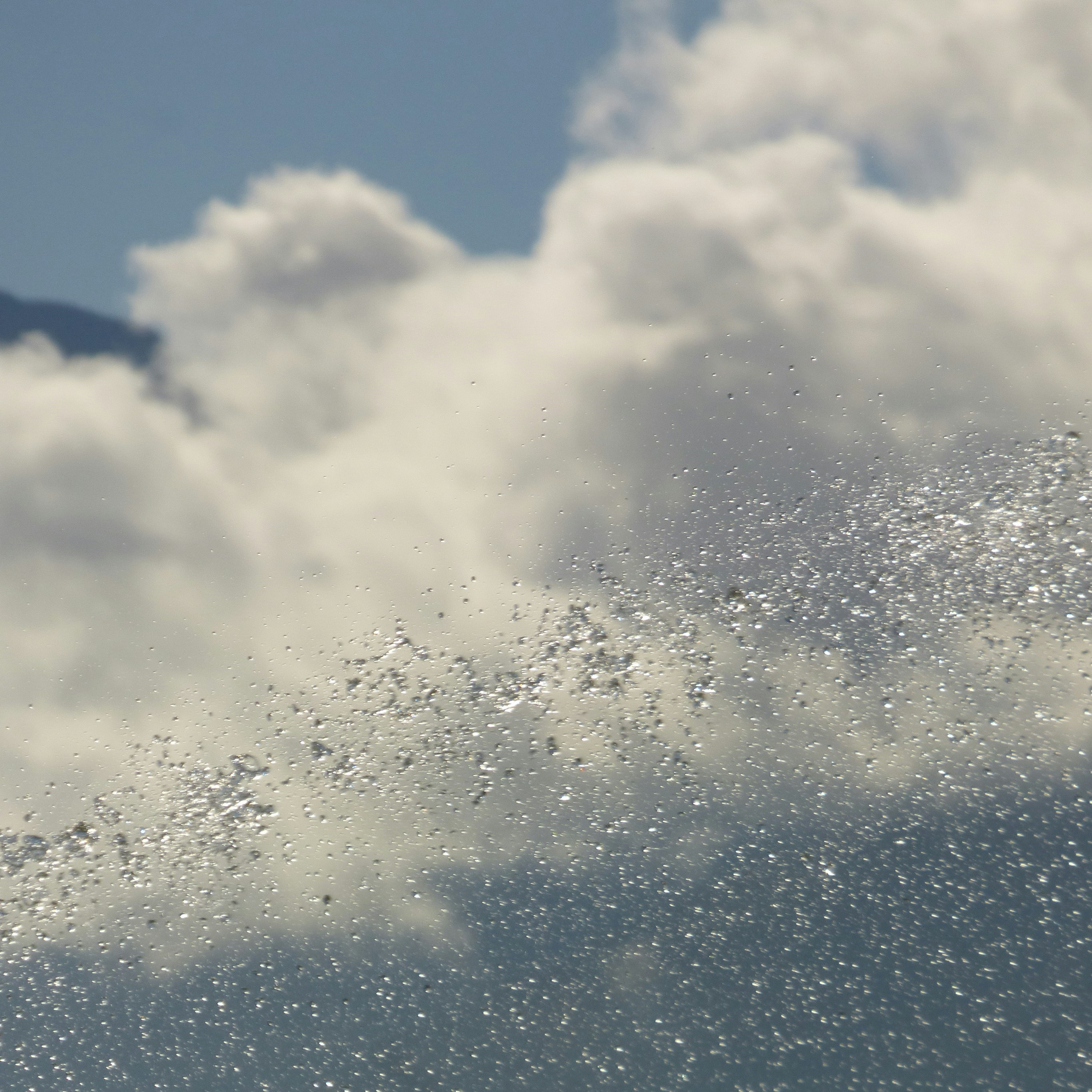 Radiant spray over a tranquil sea of clouds