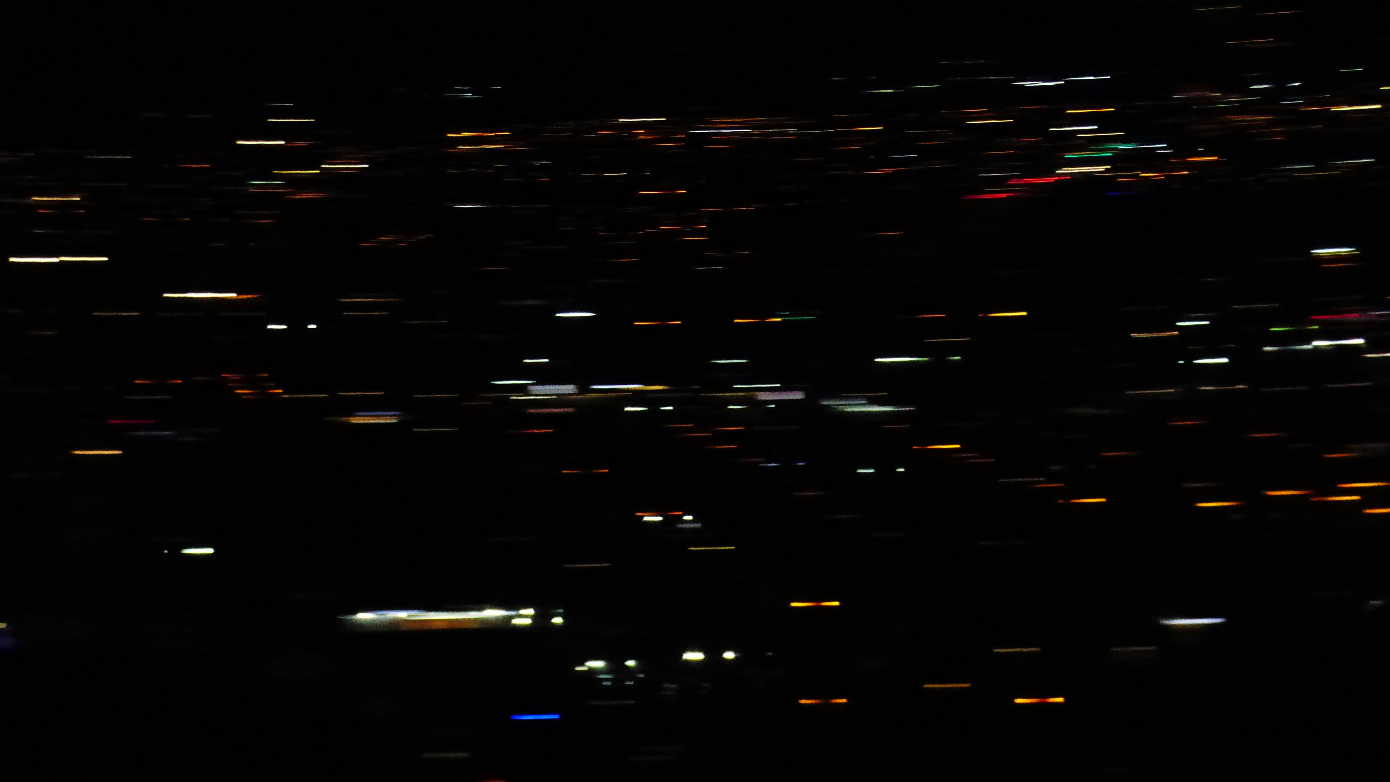 Midnight City Glow: A Sea of Distant Neon Streaks