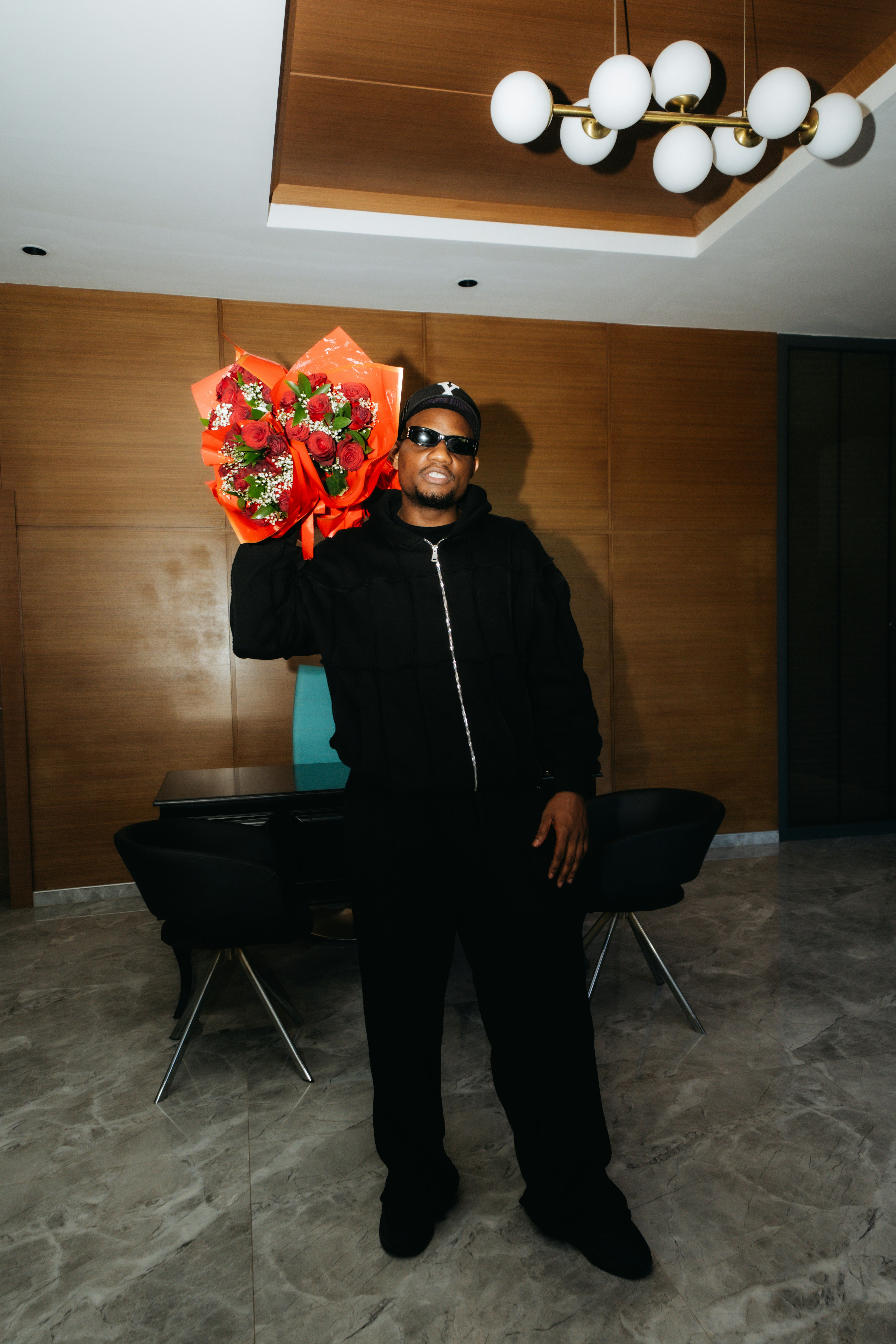 Celebration in the Lobby: A Confident Moment with Bouquet