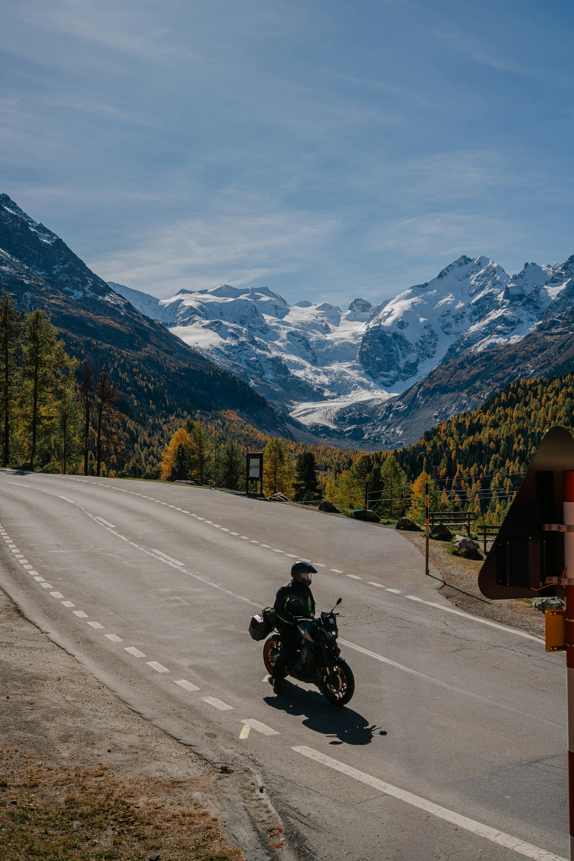 Rugged Alpine Descent: A Motorcycle Braving the Pass