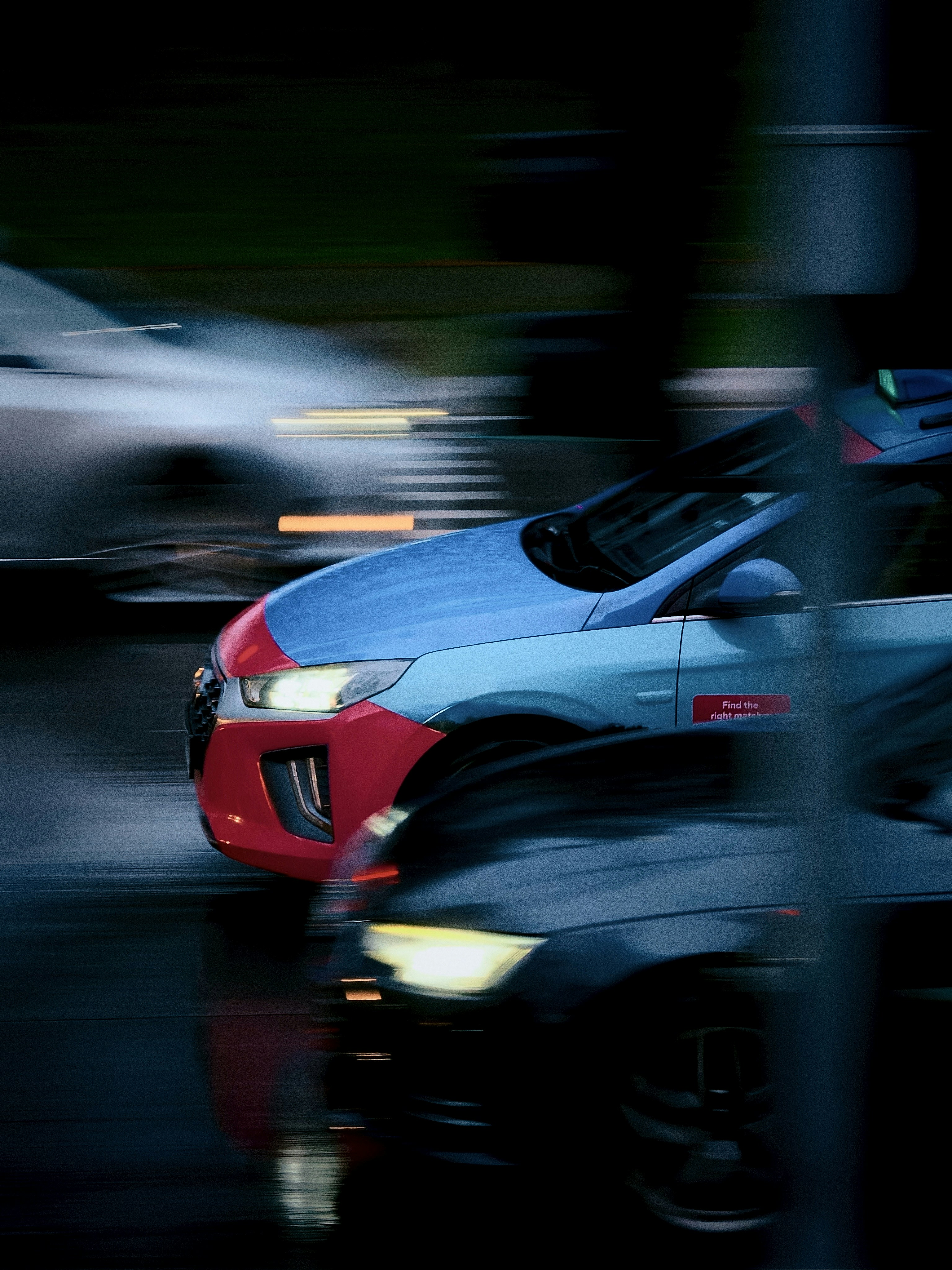 Blue Taxi in Motion: A Blur of Street Light and Speed