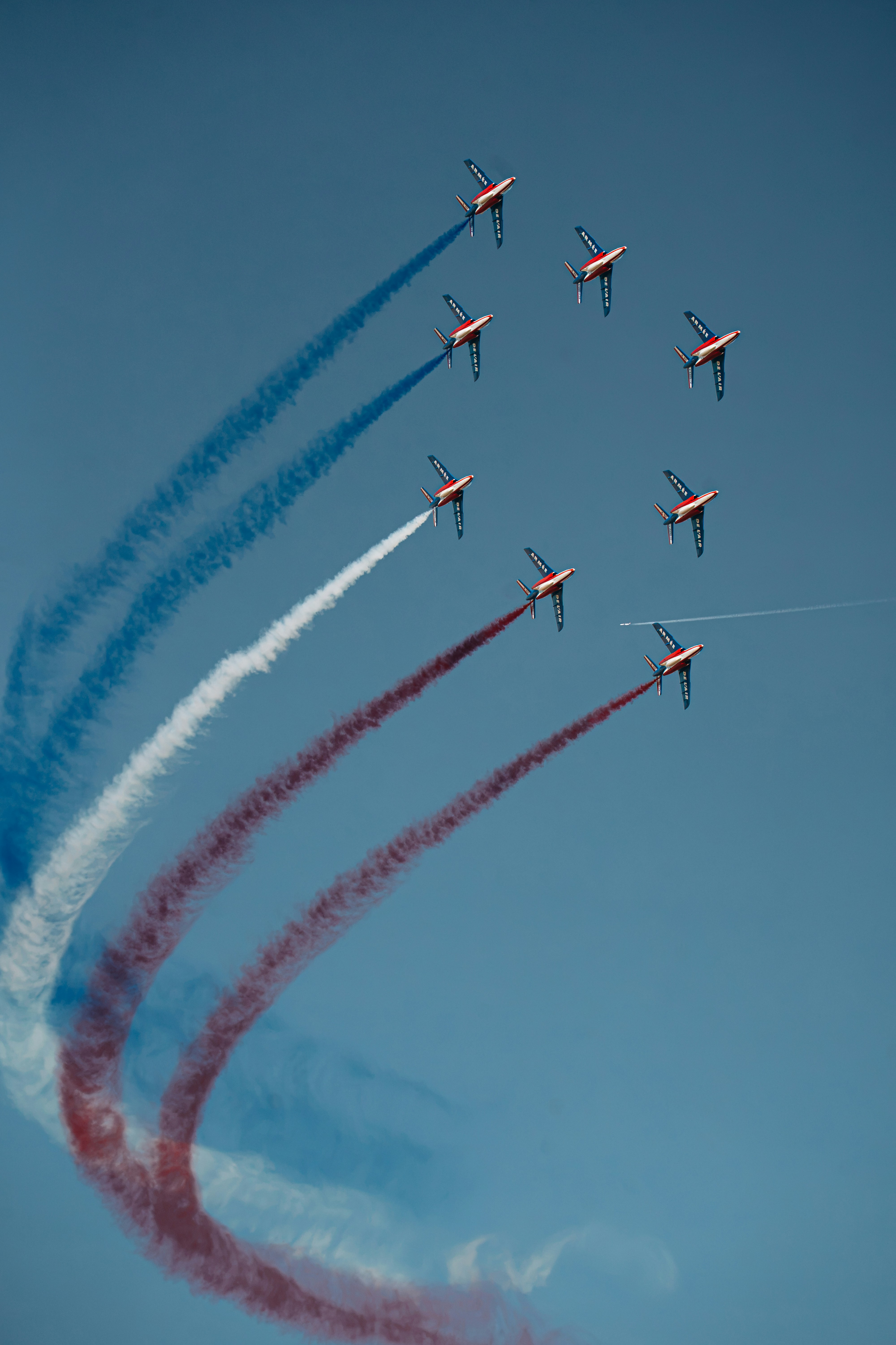 Red, White, and Sky Trails: A Flurry of Jets Across a Blue Canvas
