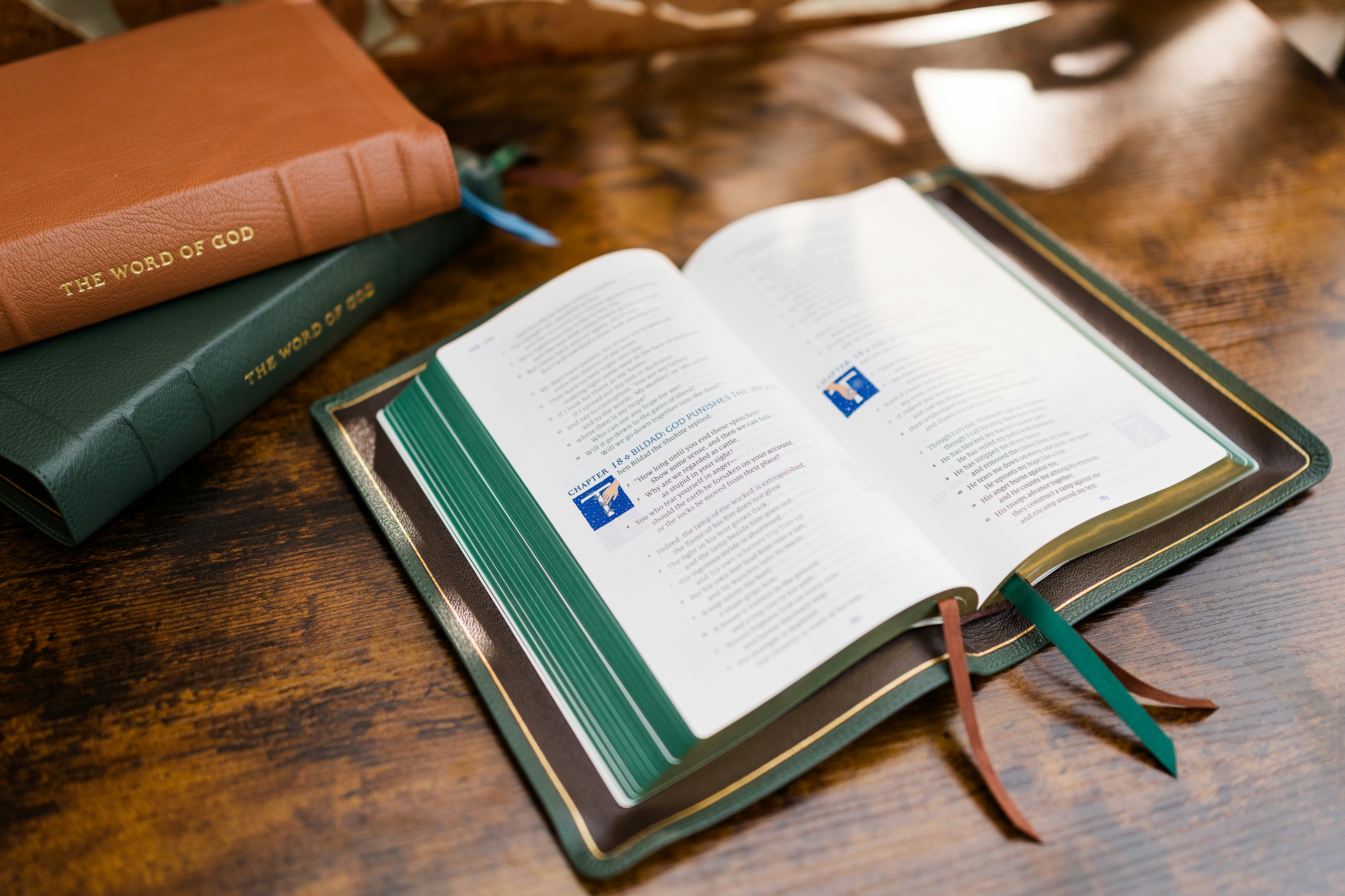 Open Bible on Wooden Desk, Soft Warm Light