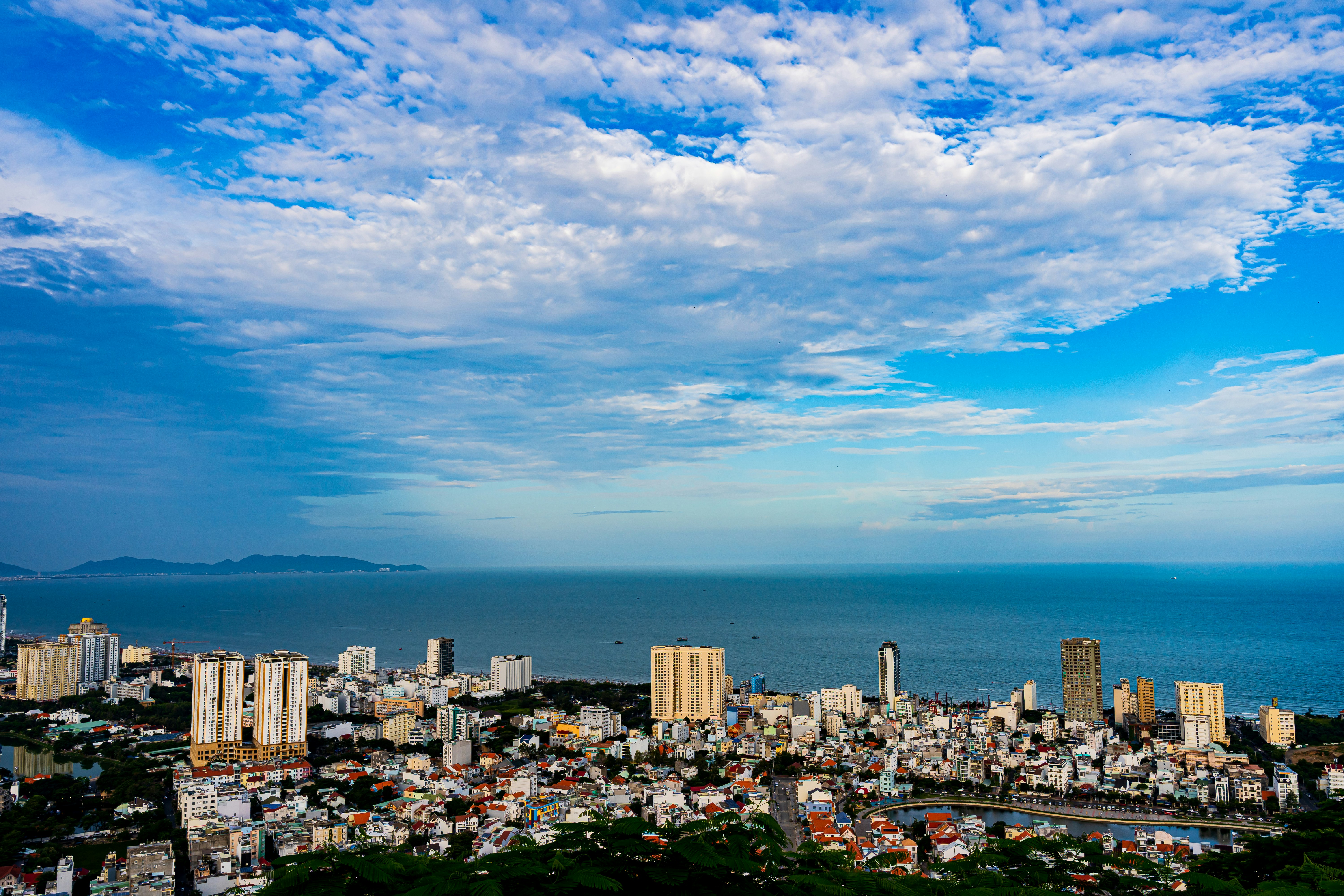Coastal City Panorama: Sky, Sea, and Skyline