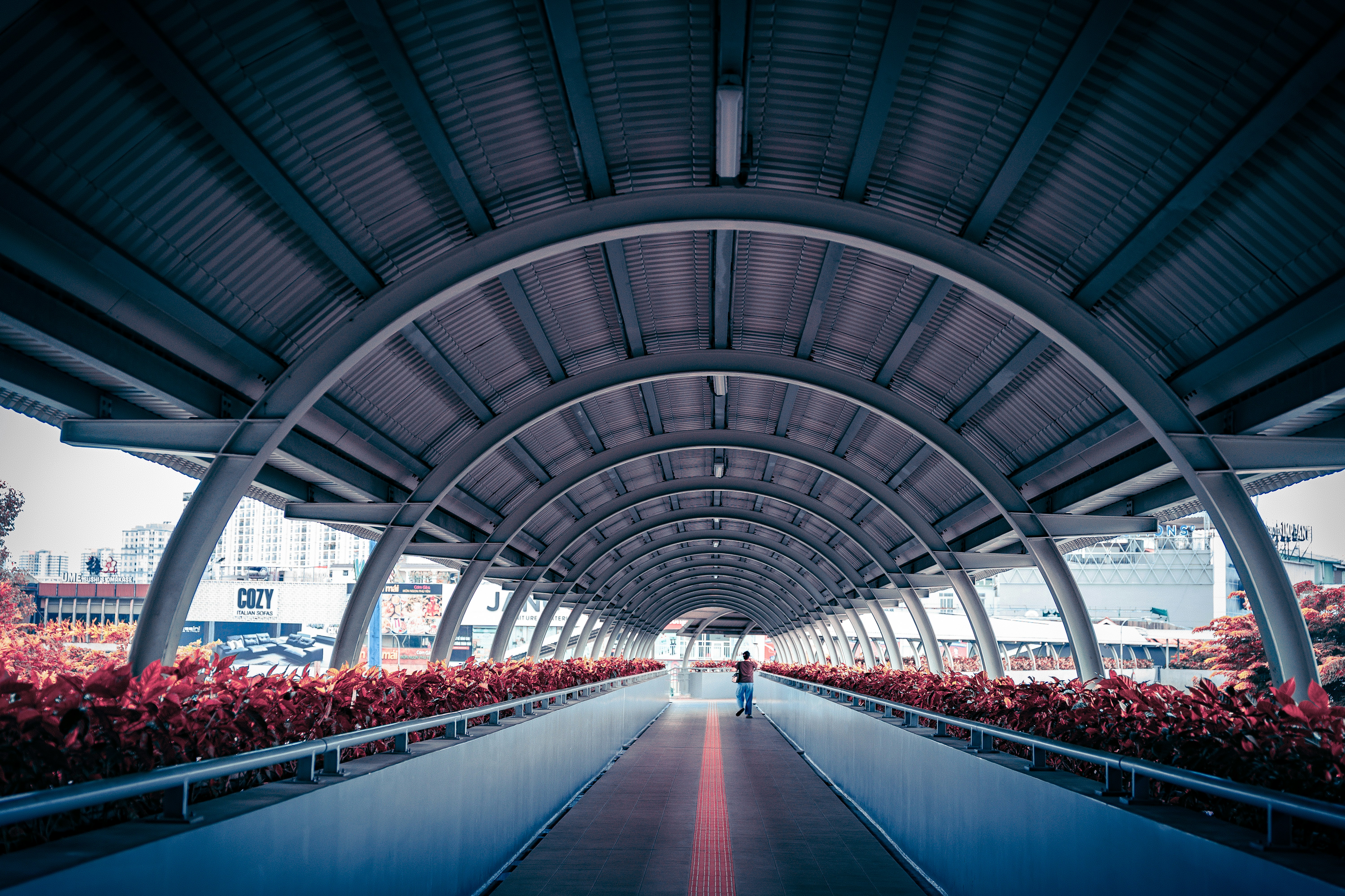 Symmetry Under the Arches: A Lone Pedestrian in the Center