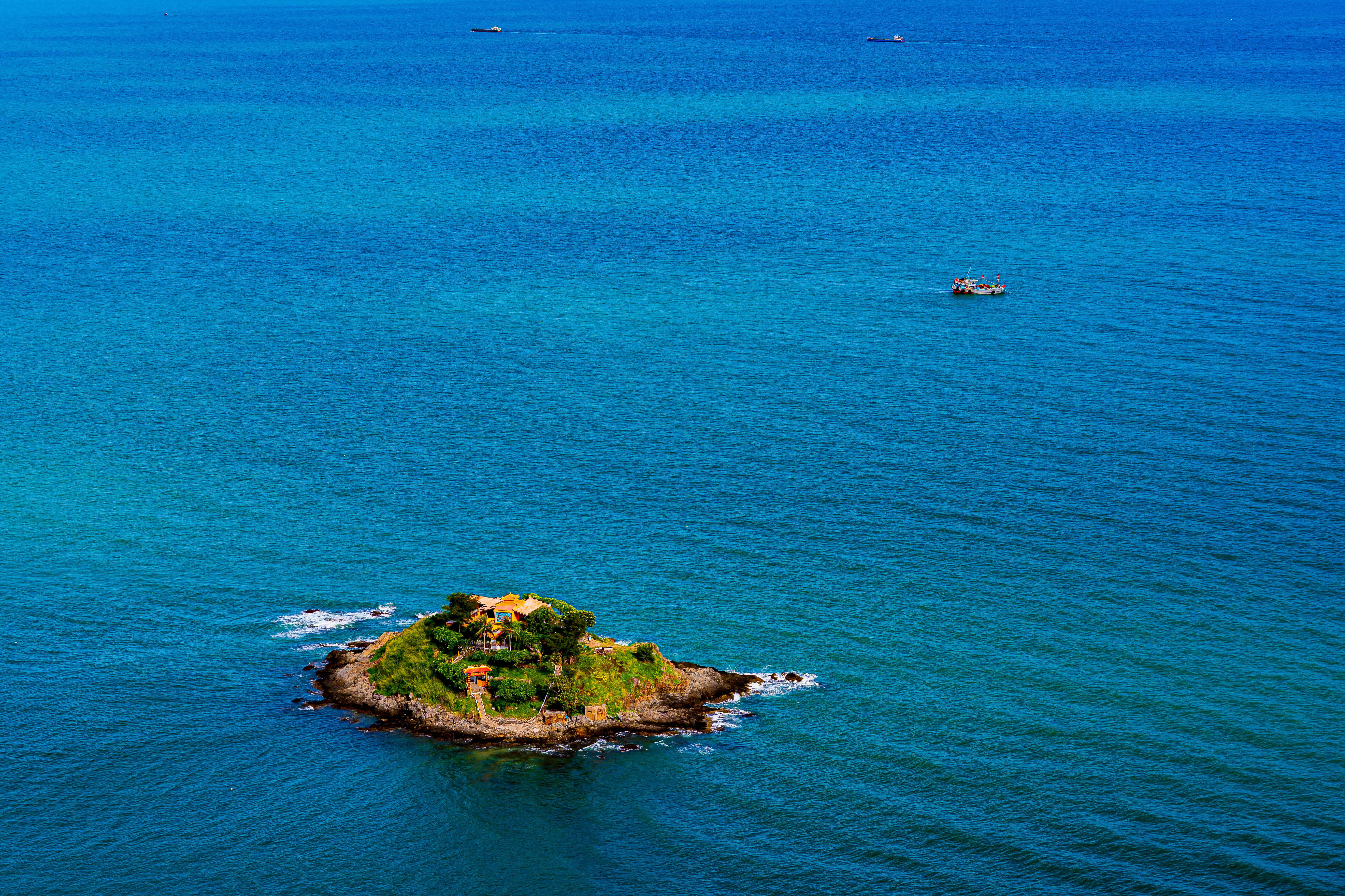 Isolated Green Sanctuary Quietly Drifting in Ocean Blues