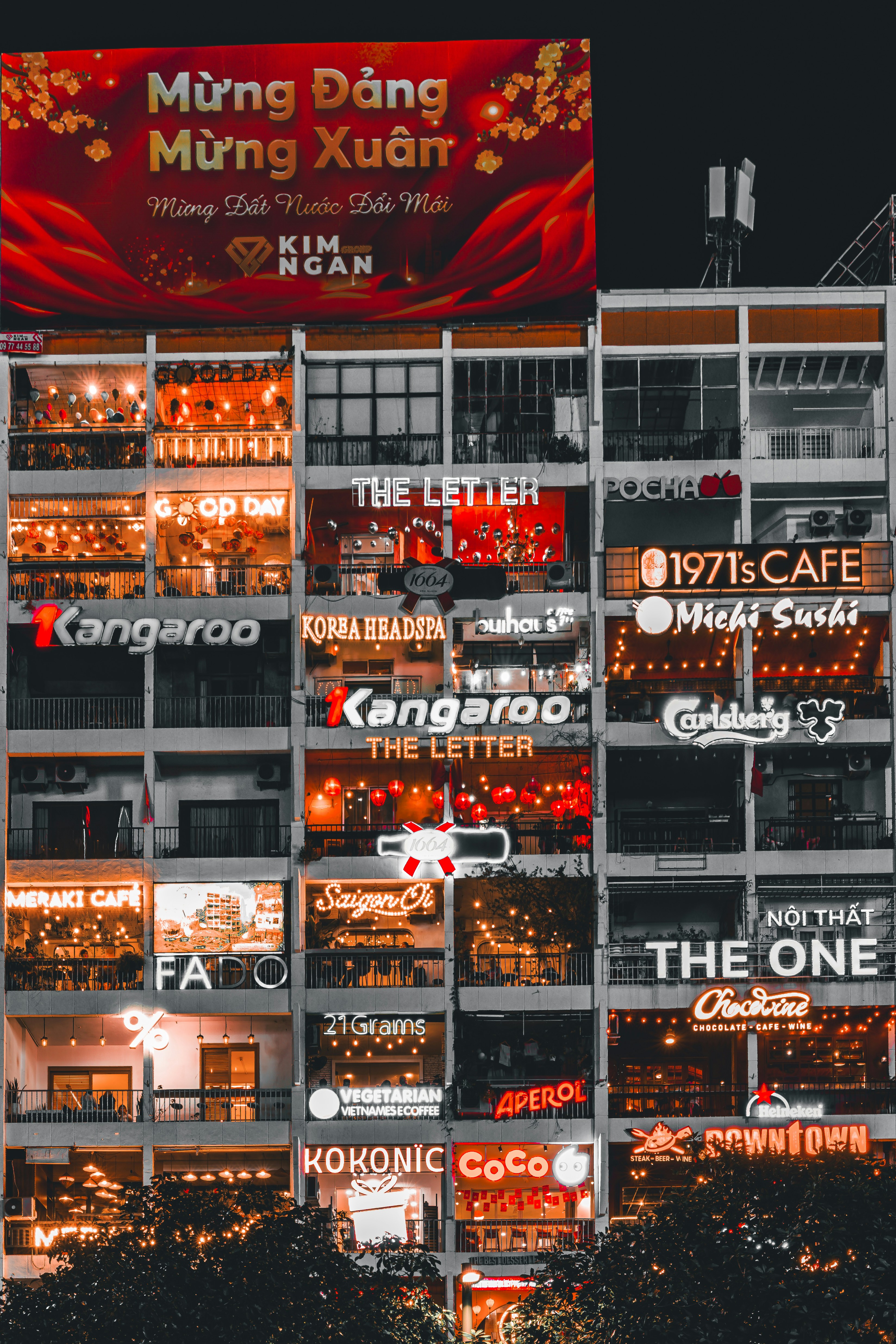Neon Facade: A Tower of Lanterns and Logos