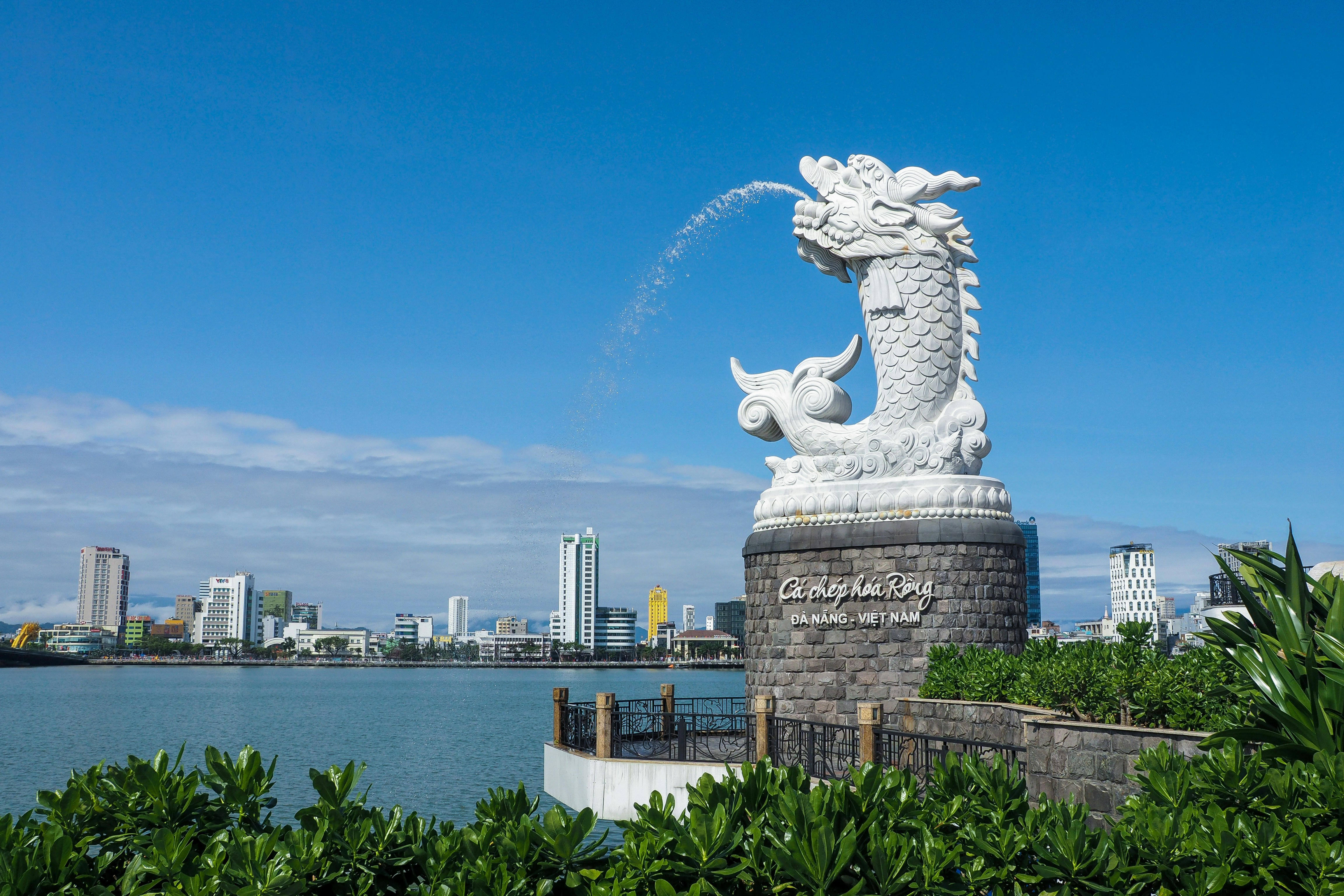 Carp-turning-into-dragon statue on the banks of the Han River in Da Nang, Vietnam.