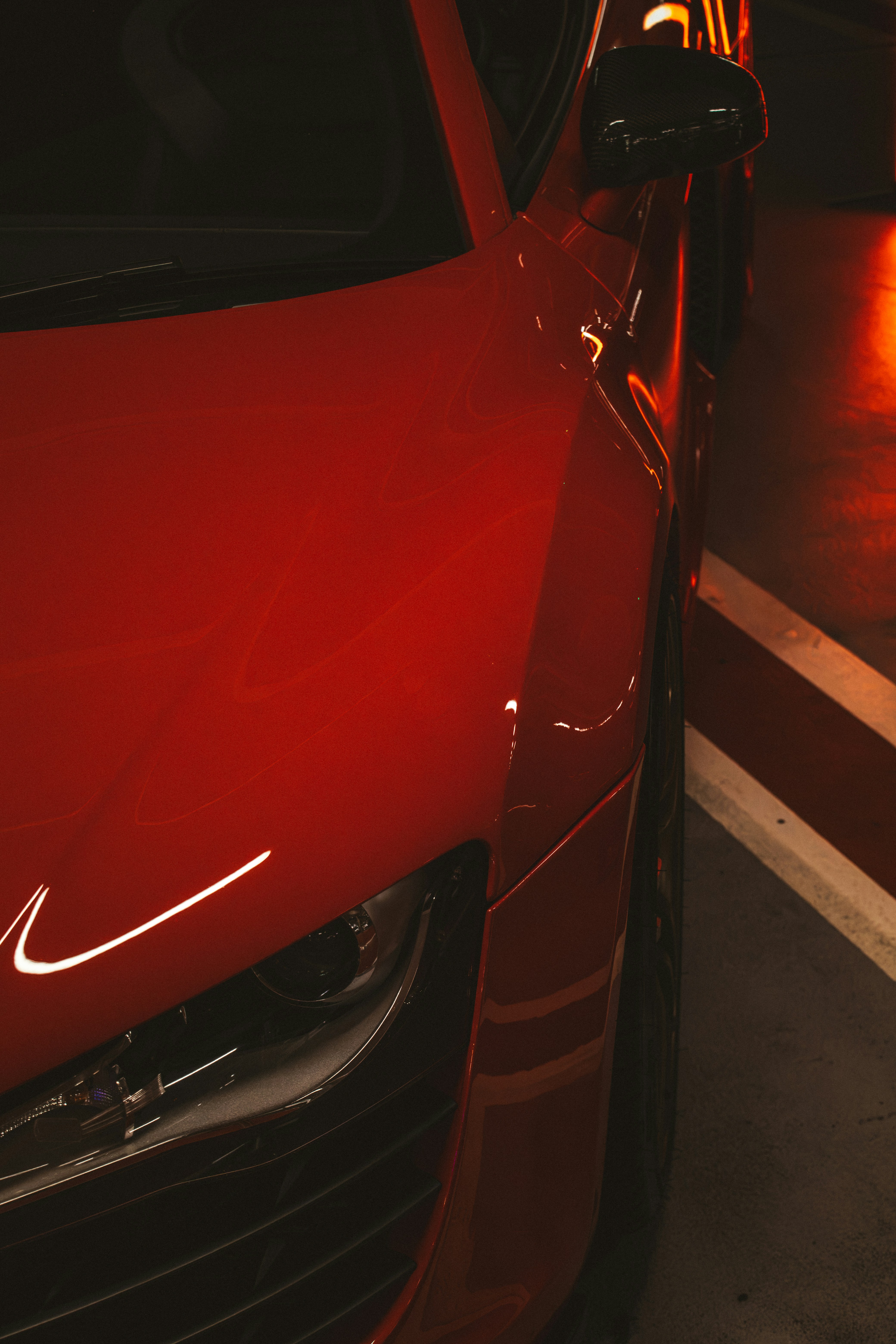 Red Droplet Edge: A Car’s Quiet Hour In Neon Night