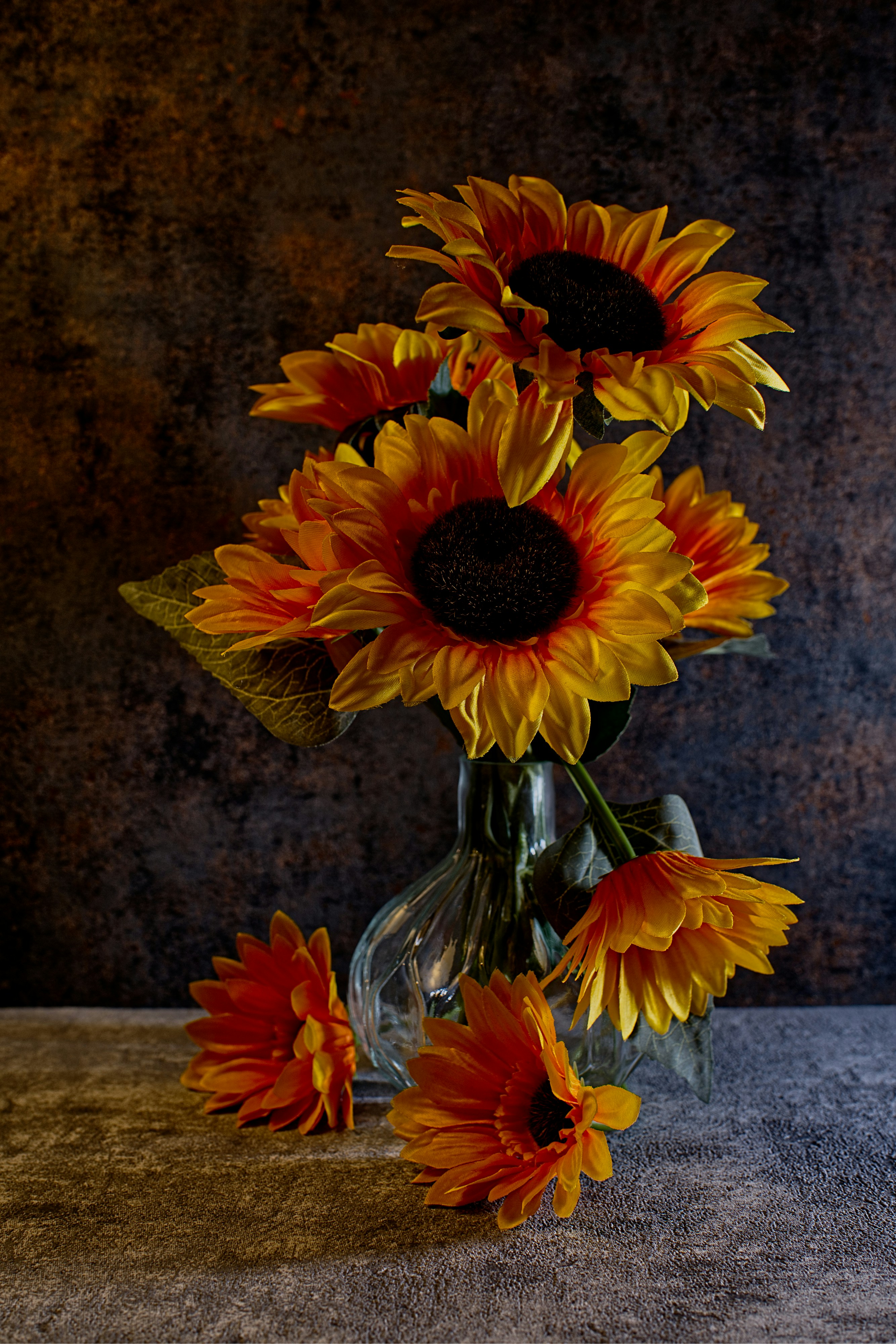 Sunflower Bouquet in a Glass Vase Against a Rustic Backdrop