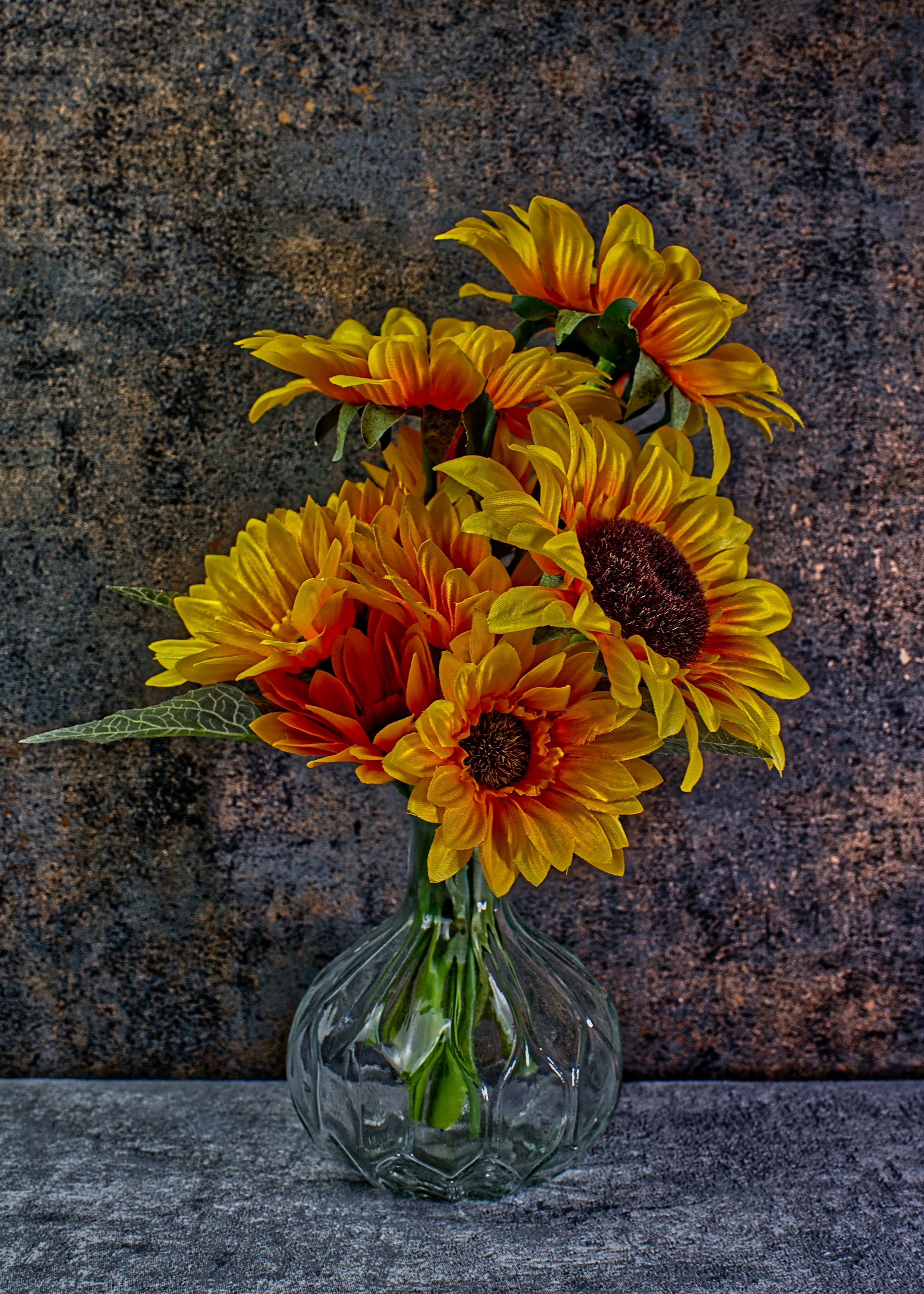 Sunlit Crimson-Amber Blooms in a Glass Vase