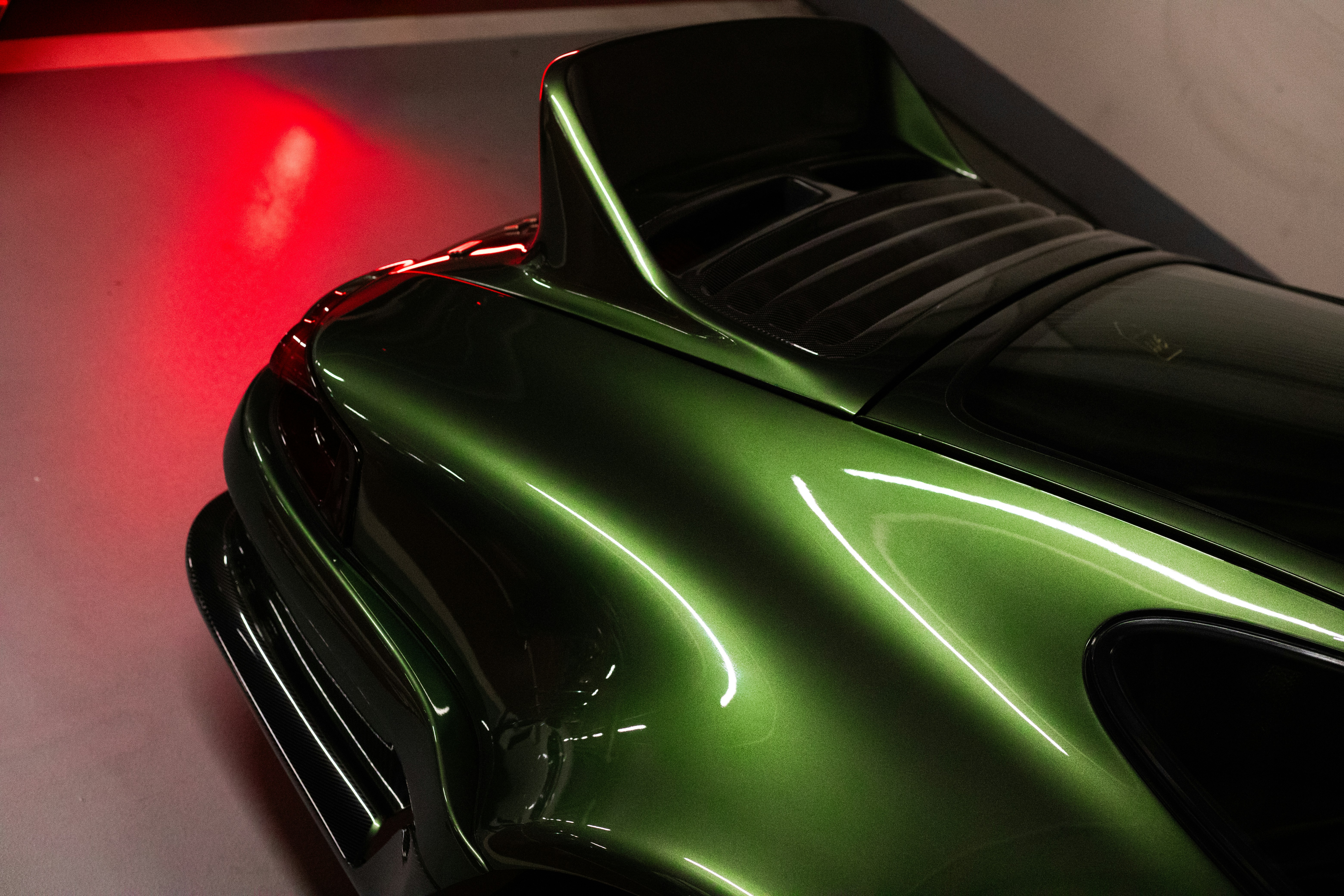 Emerald Curves: A Green Classic Under Neon Light