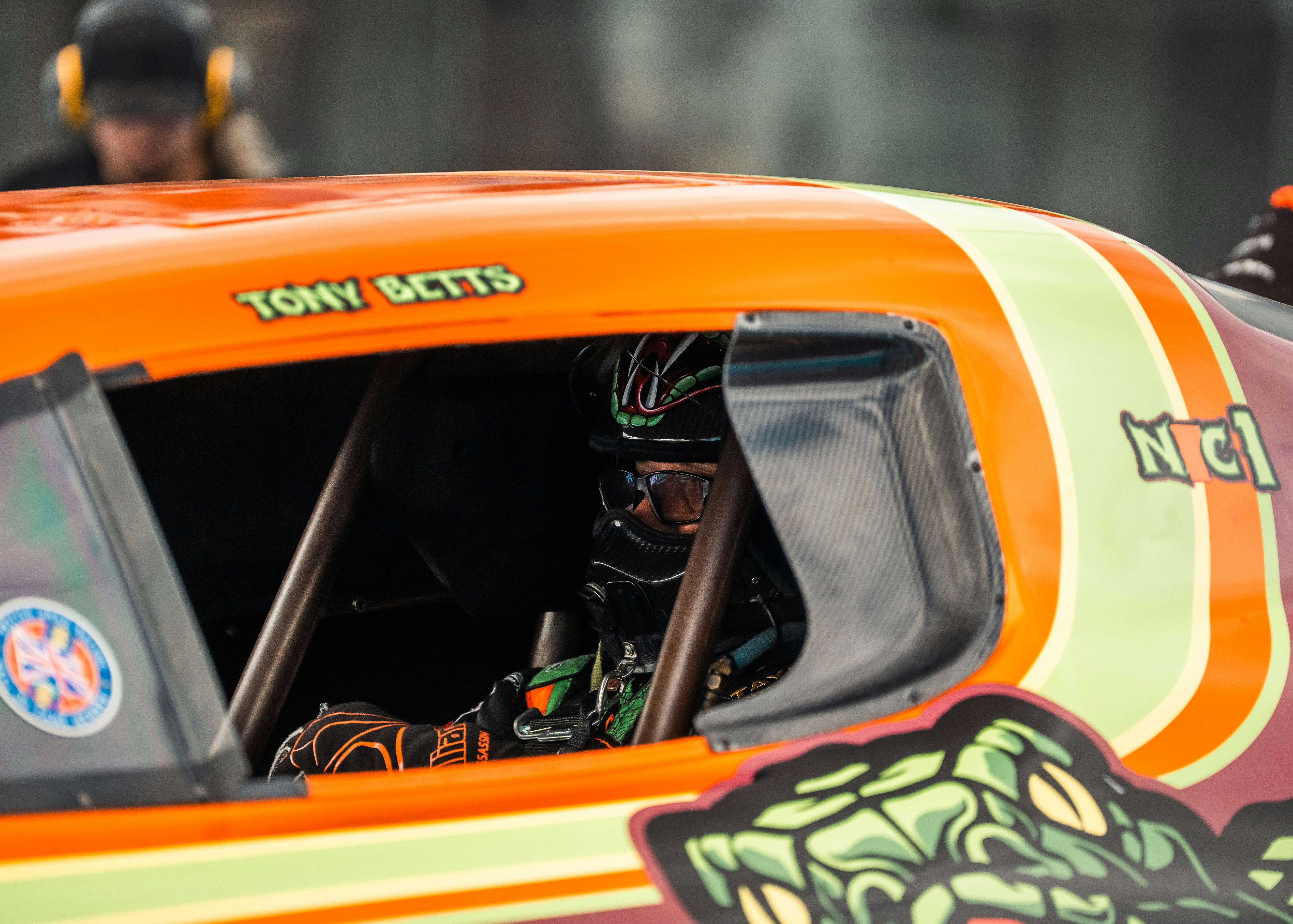 Driver in the Orange Marlboro-inspired Race Car Tennessee