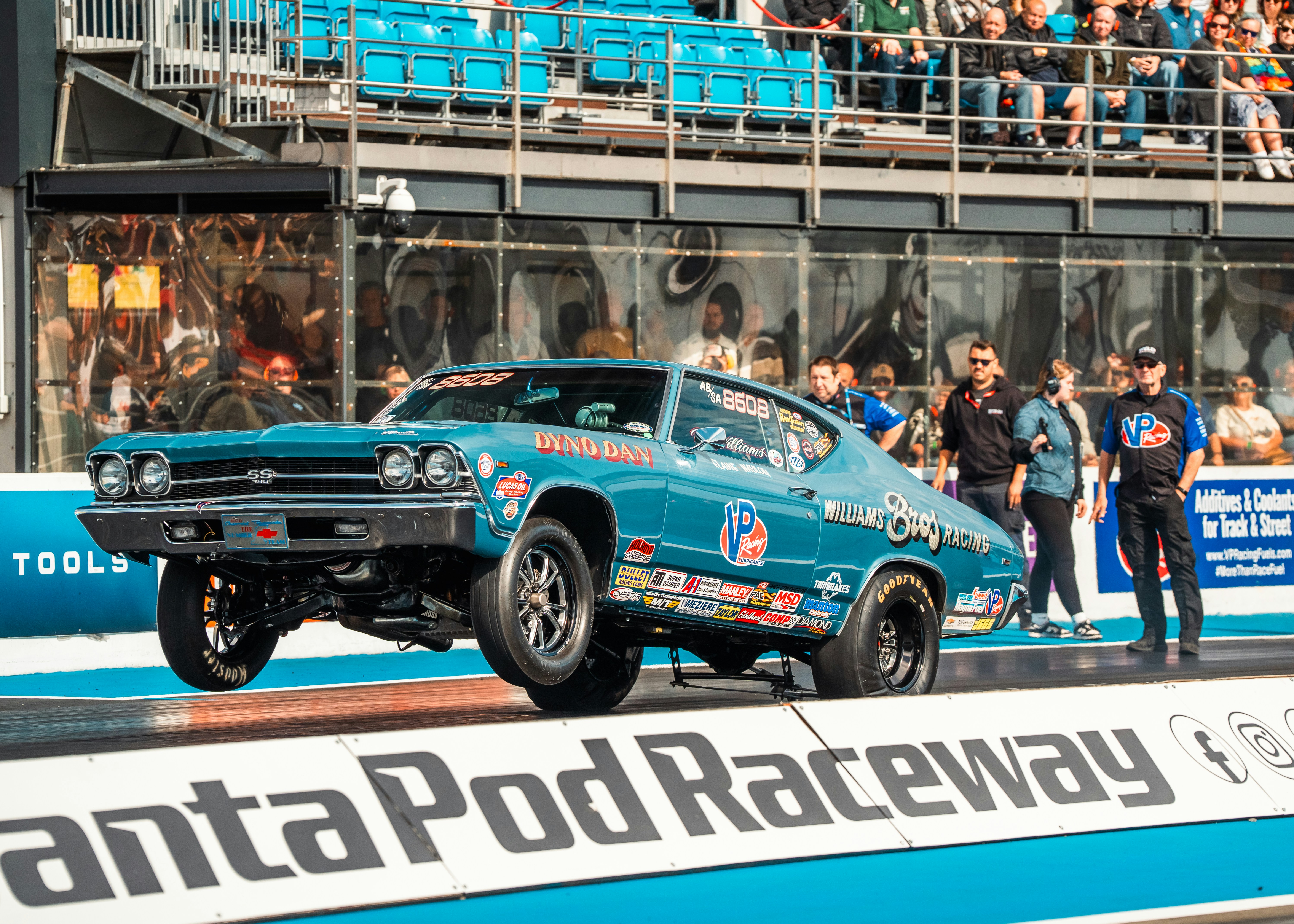 Blue Drag Racer Lifts Front Wheels at Santa Pod