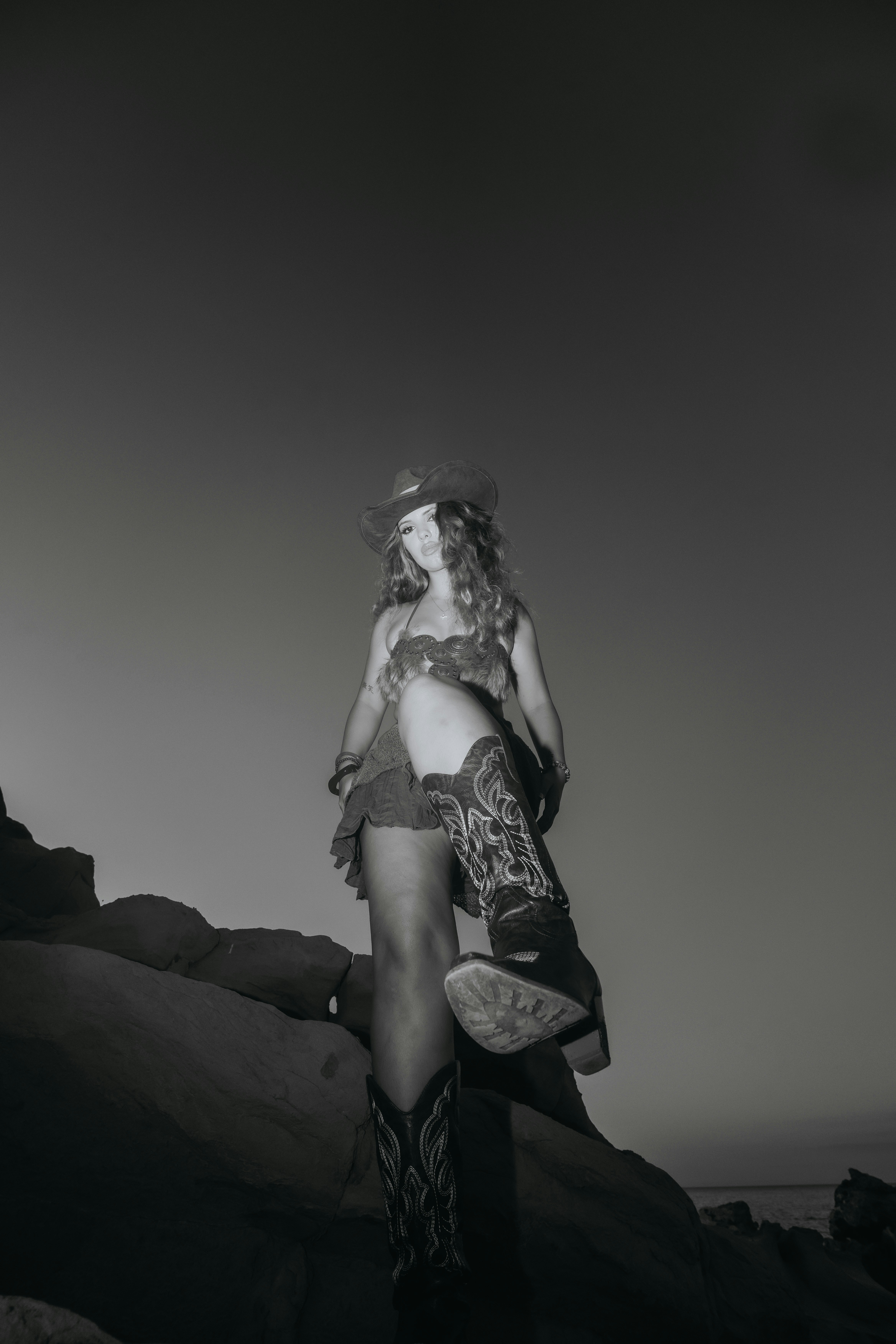 Desert Dune Cowboy: A Moonlit Pose Beneath the Horizon