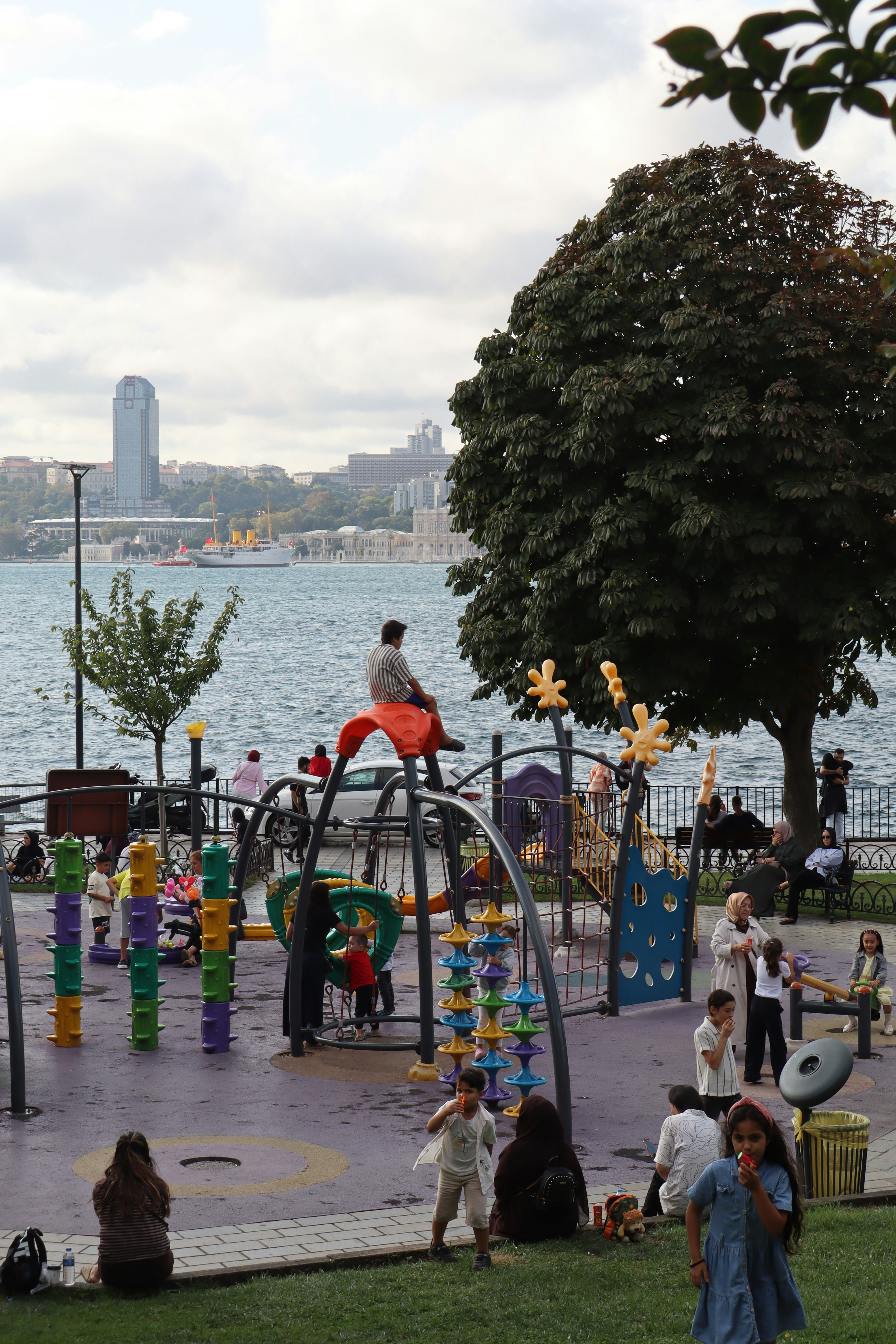 Lakeside Playground Demands Attention: A Busy City Park by the Water