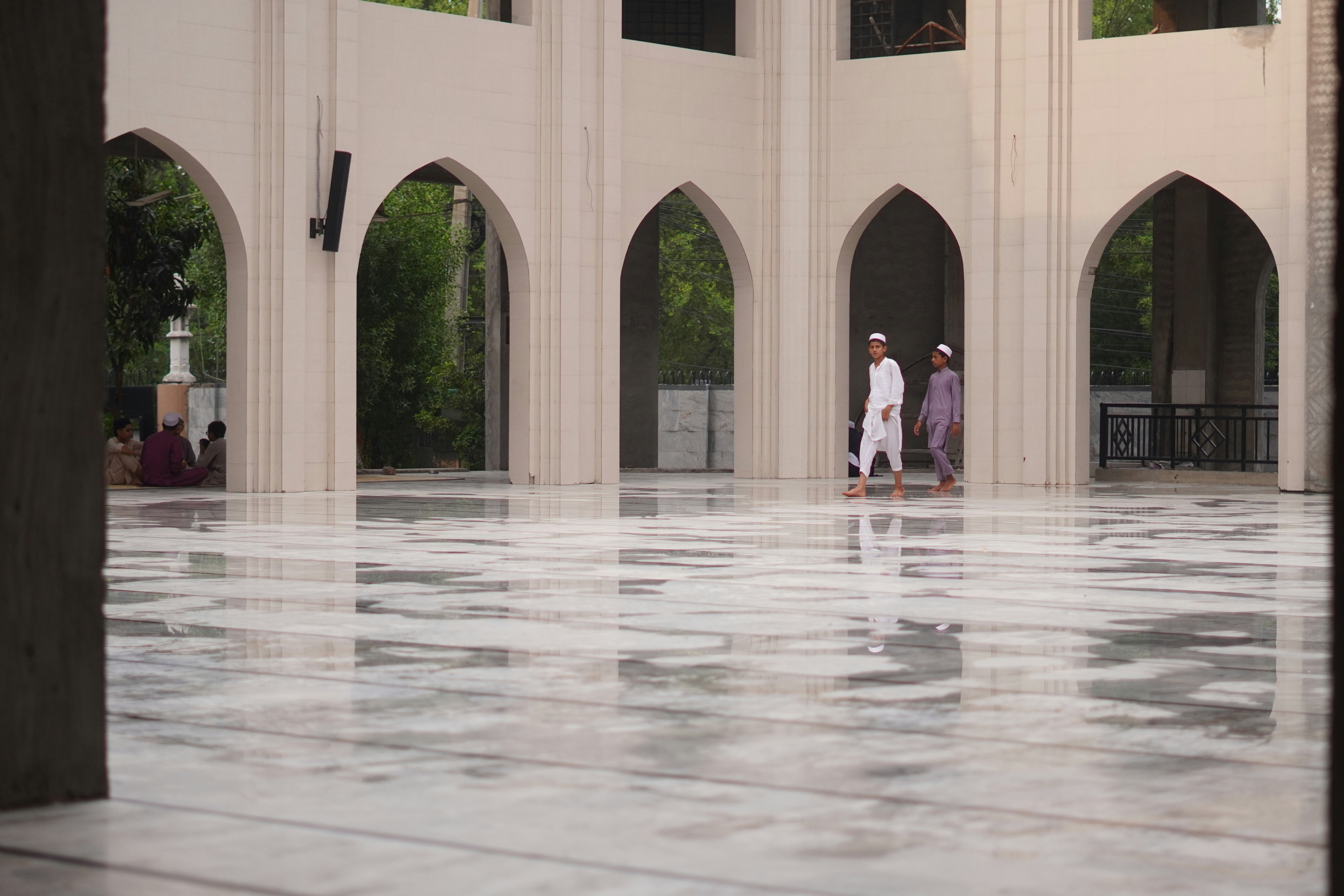 Arched Pavilion Echoes: Quiet Walk Along Polished Marble