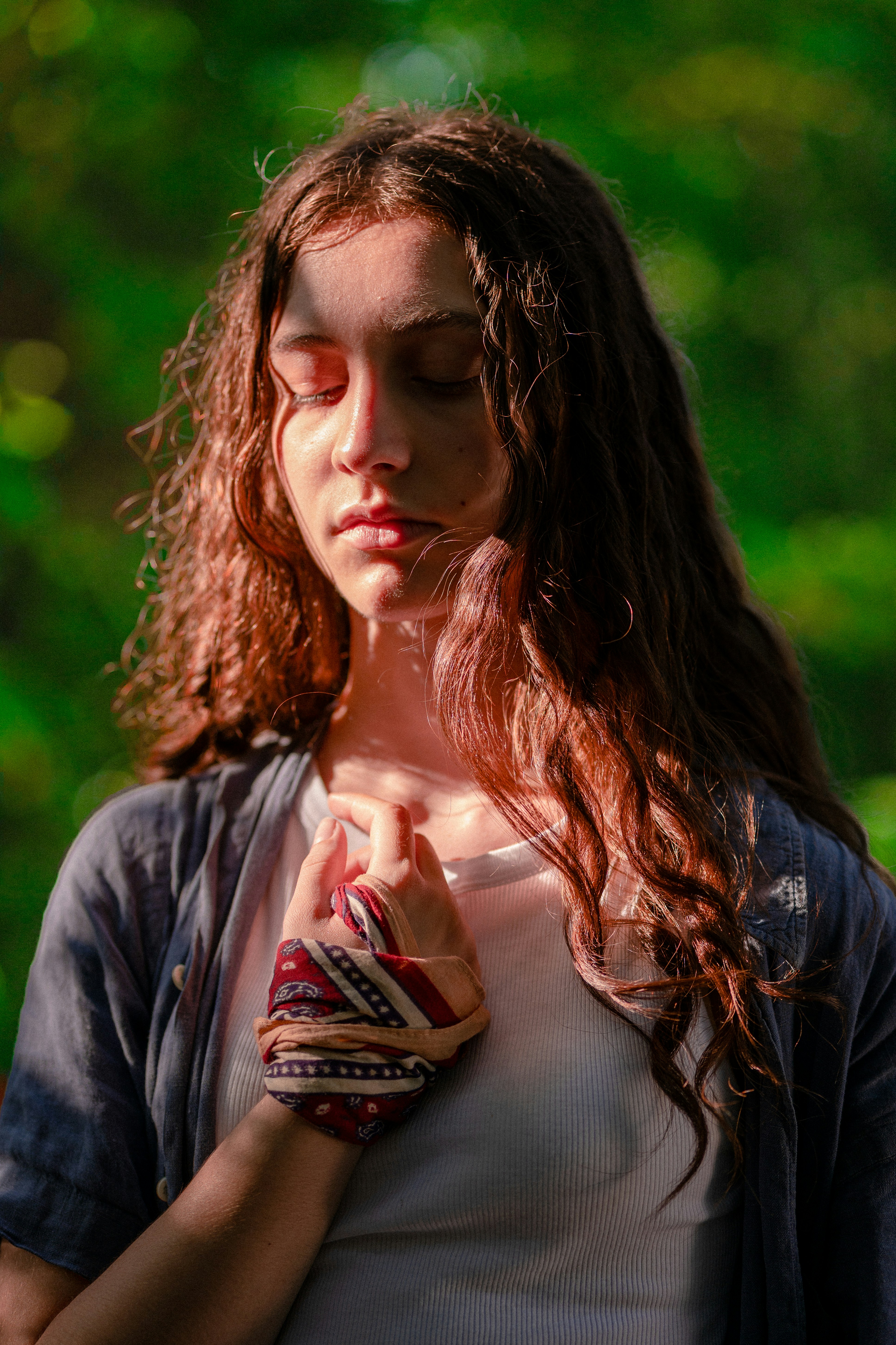 Serene Portrait in dappled light, with eyes softly closed