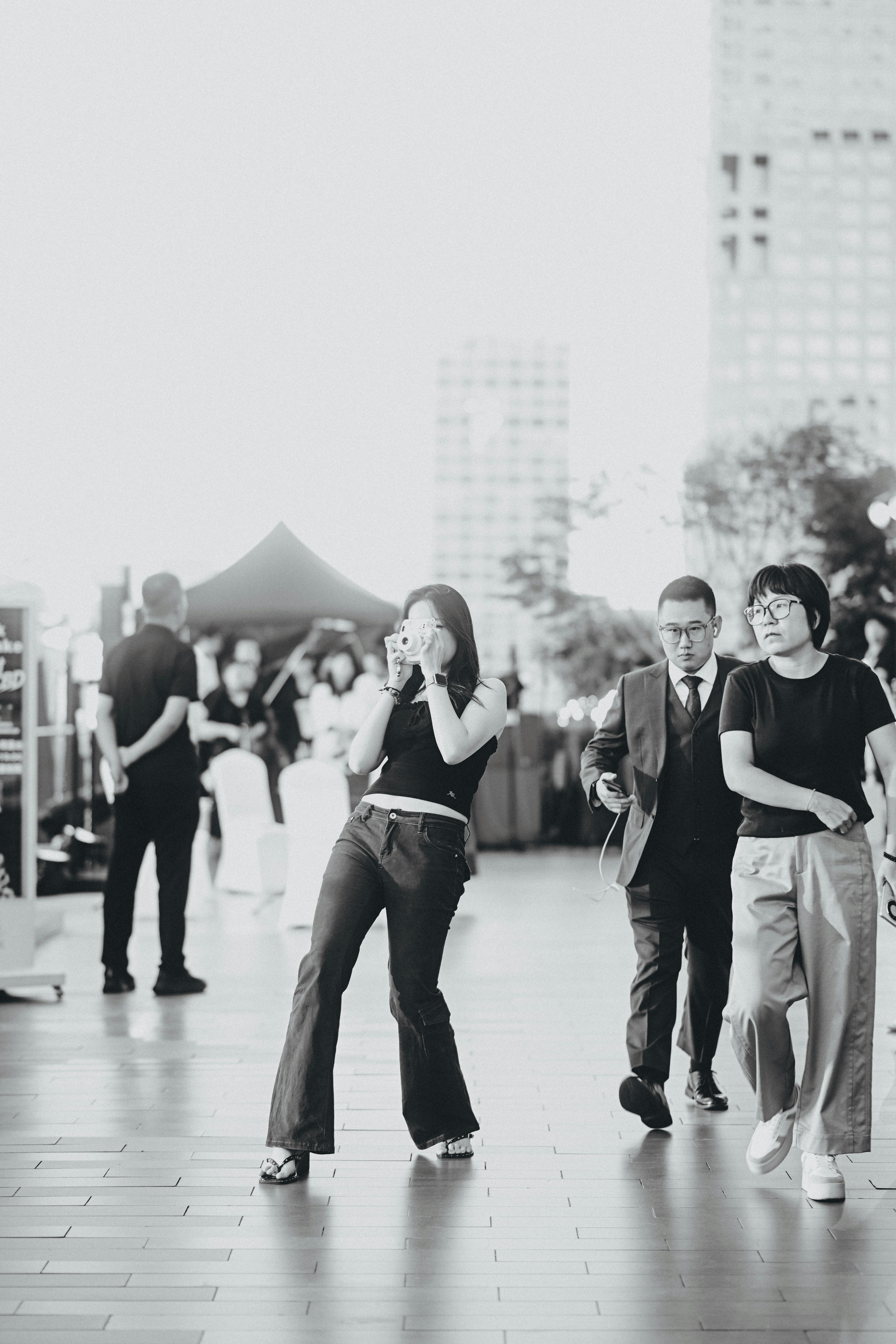 Candid Street Moment: A Photographer in Motion