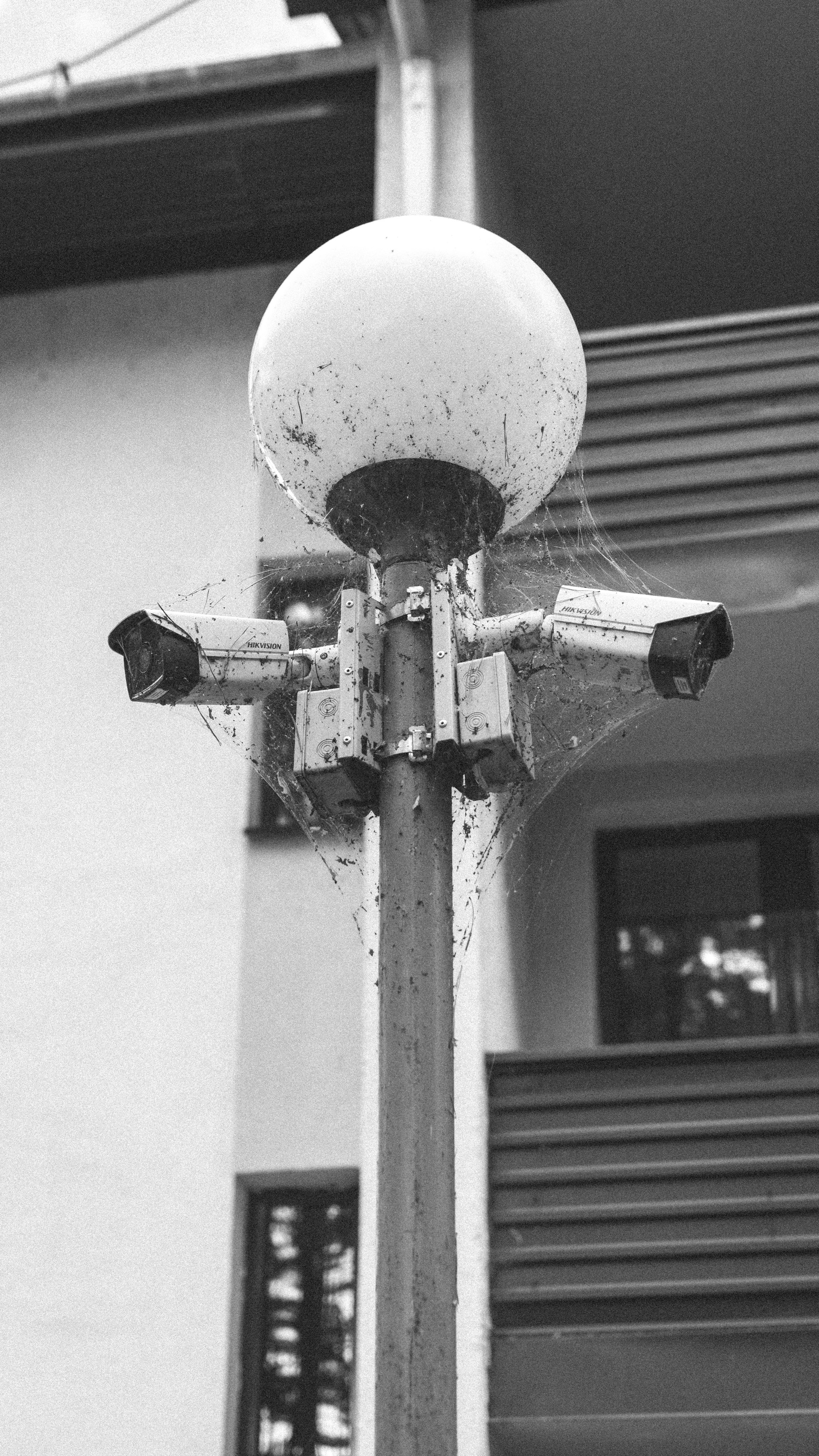 Dusty Globe of Light: A Quiet Street Lamp in Mono