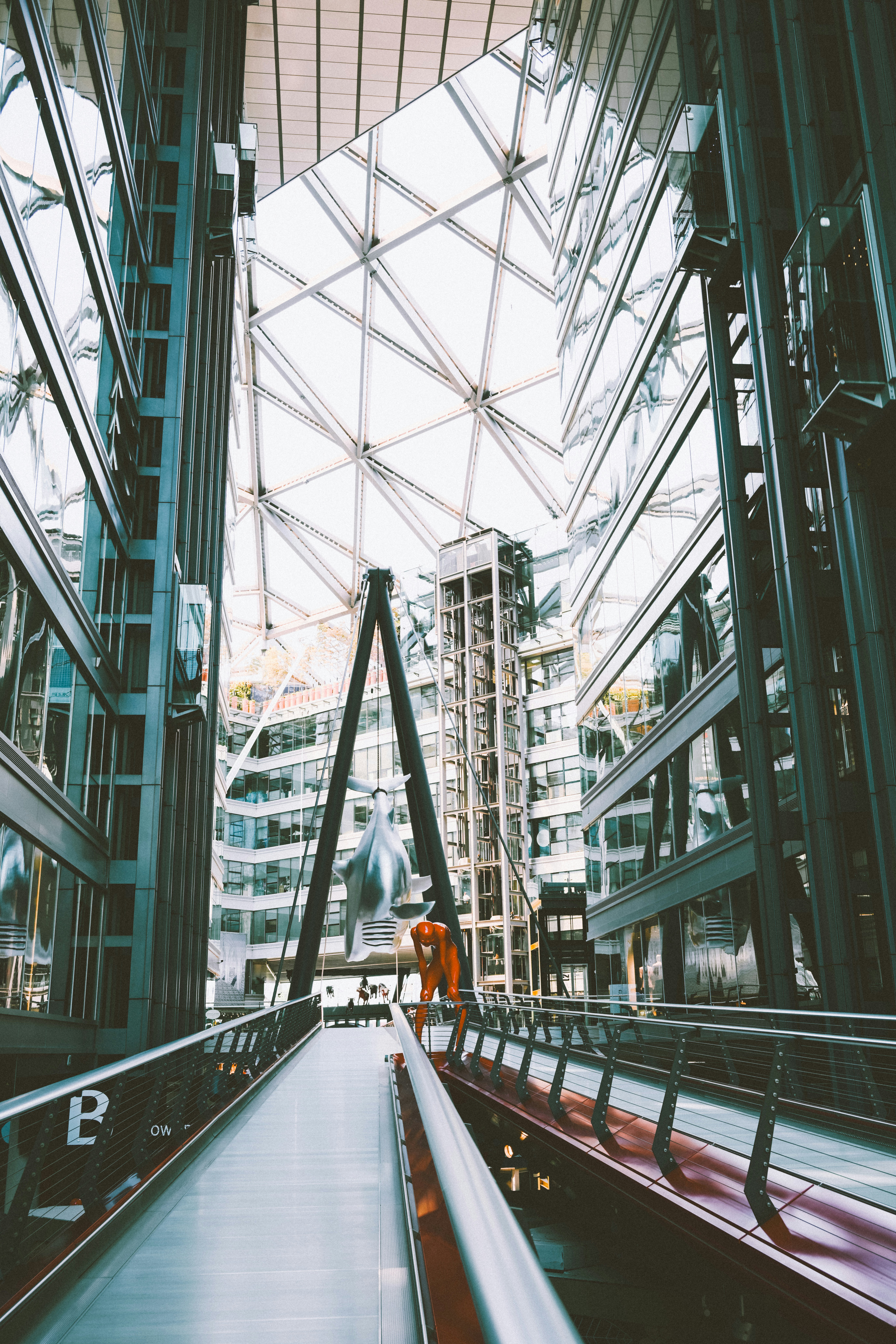 A Glass Cathedral: Escalator Hourglass in a Steel Oasis