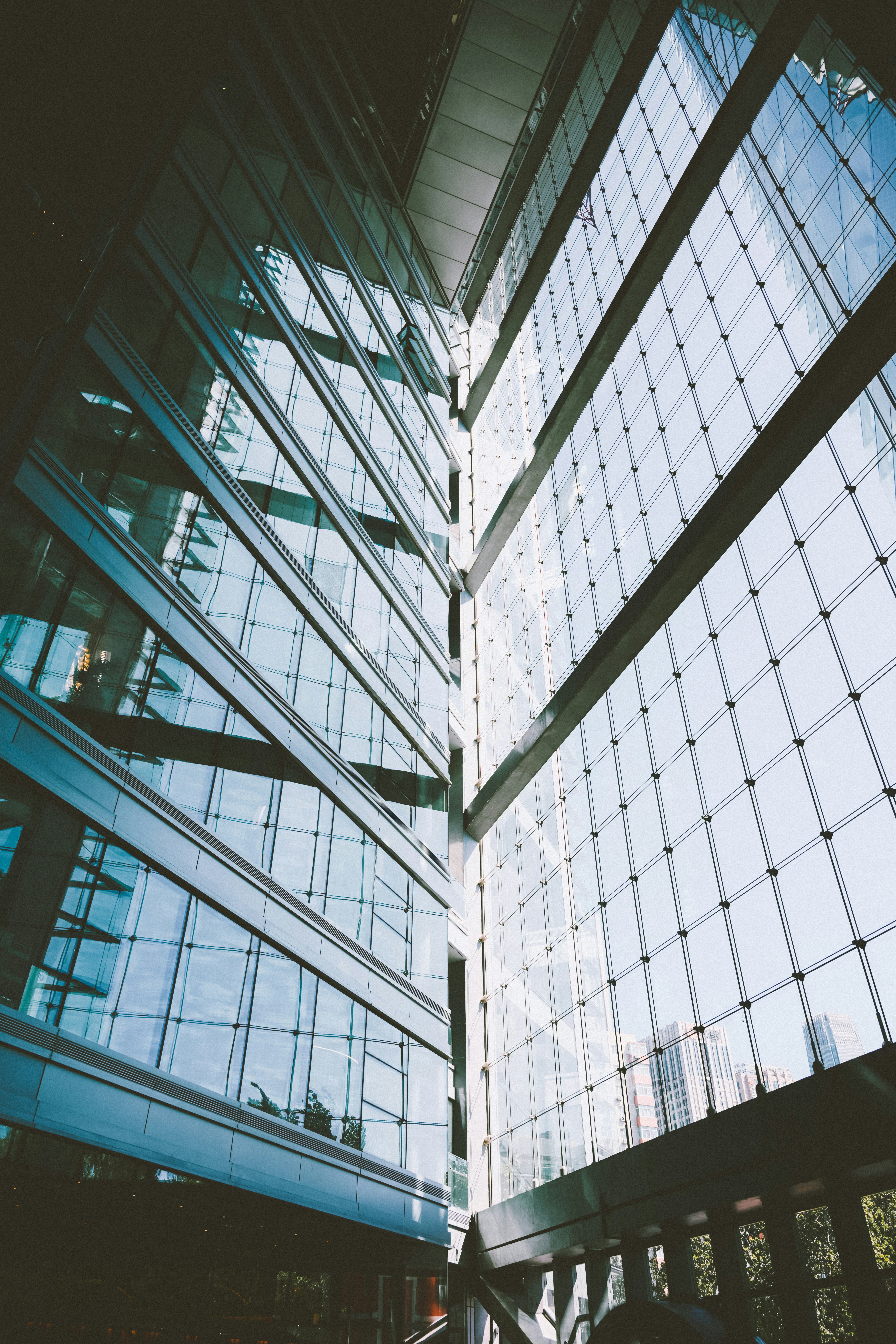 Converging Glass: A Skyward Dance Through Modern Facades